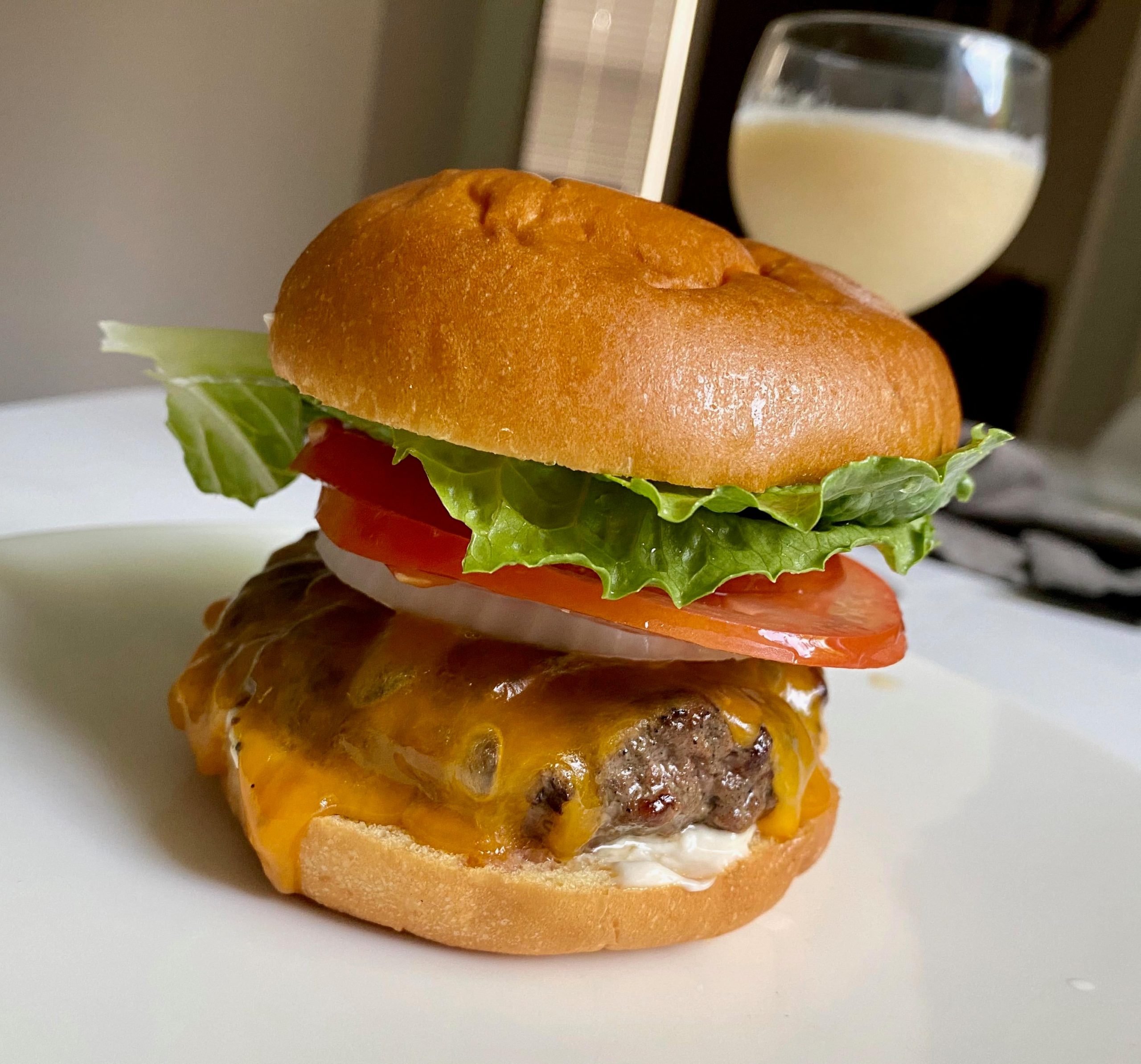 Simple cheeseburger with quality butcher meat on a French butter bun ...