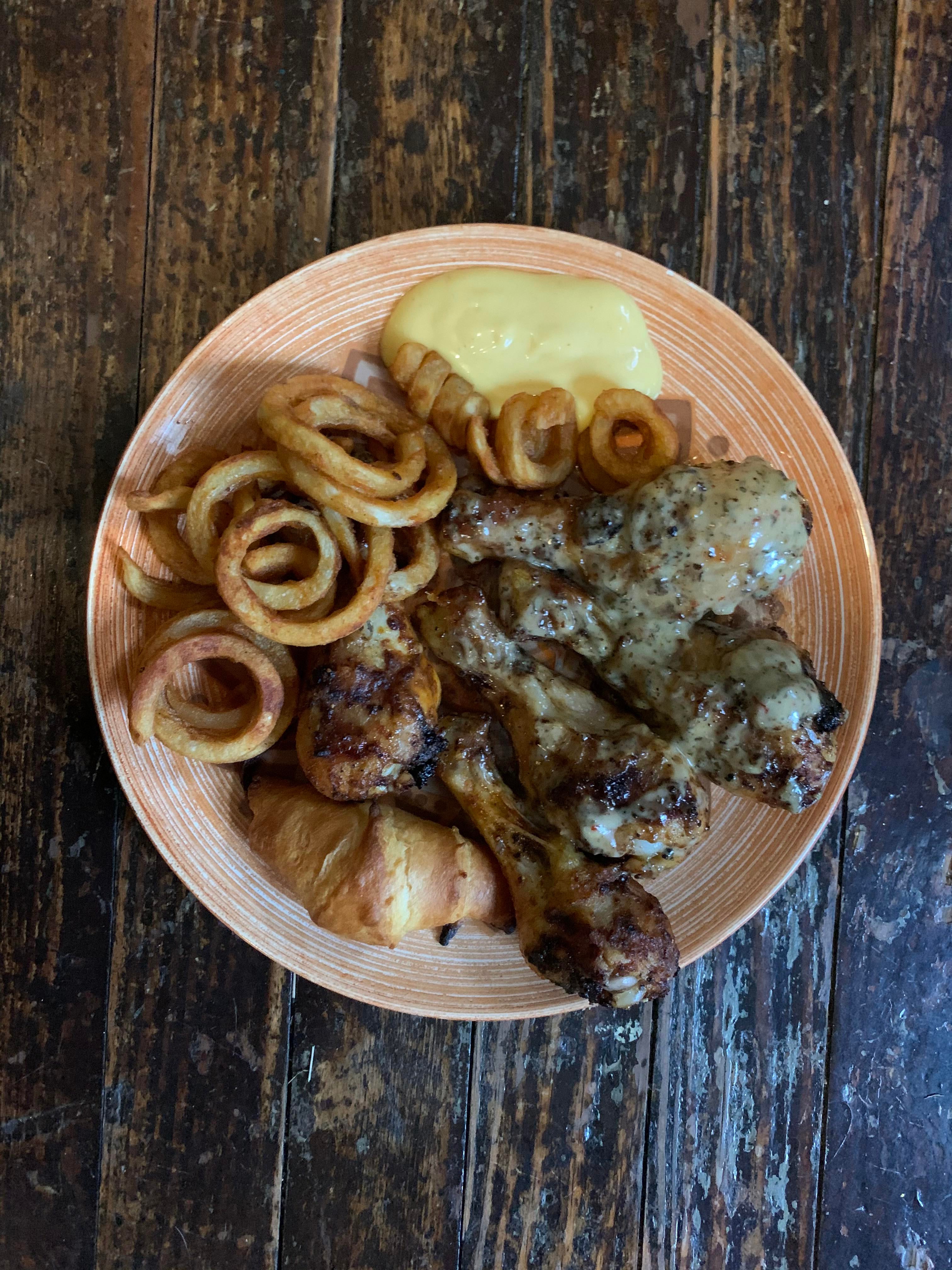 Chicken drummies, curly fries and a crescent roll. Buffalo and Parmesan ...