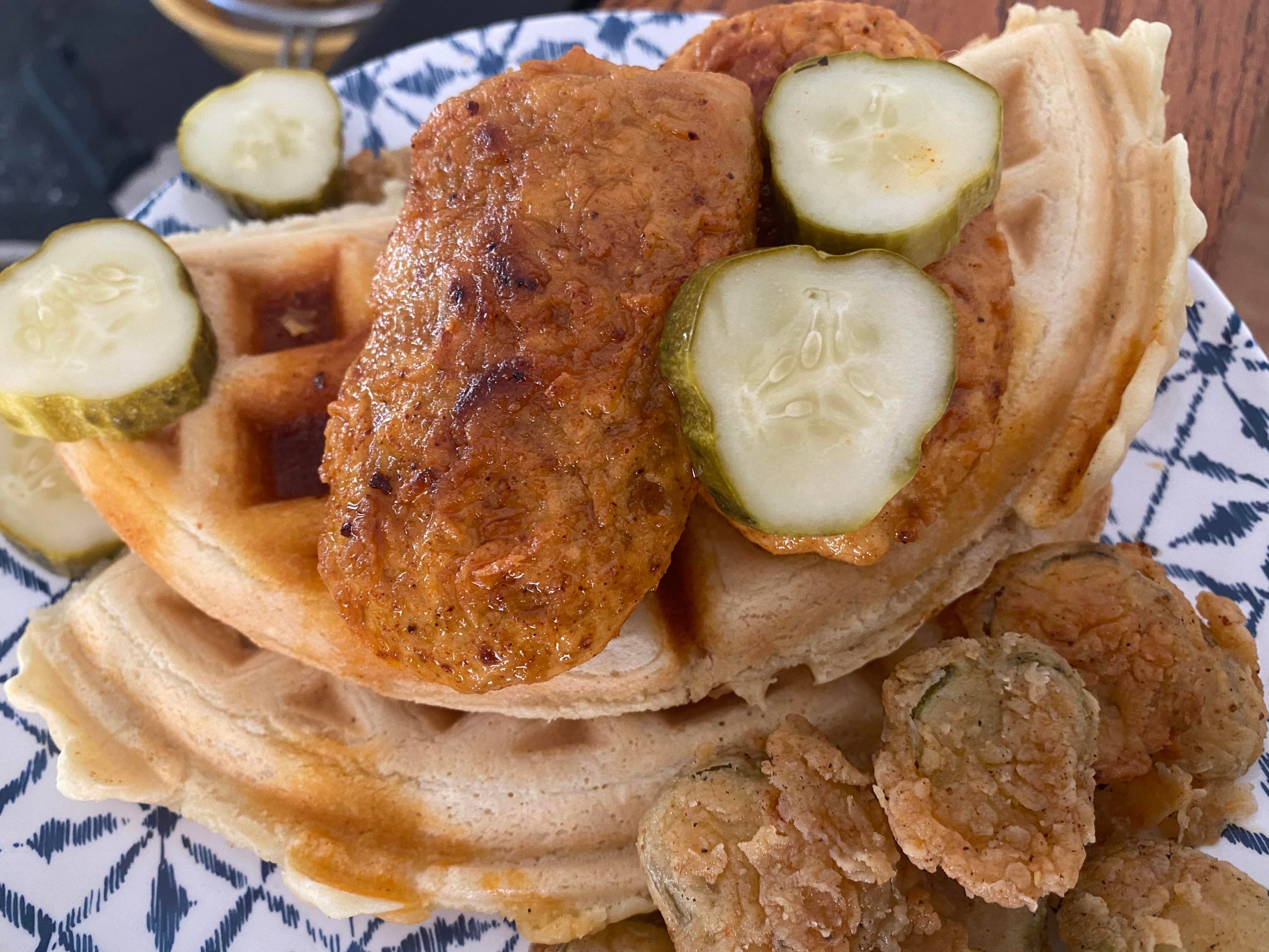 hot seitan served over waffles with fried pickles; what it lacks in ...