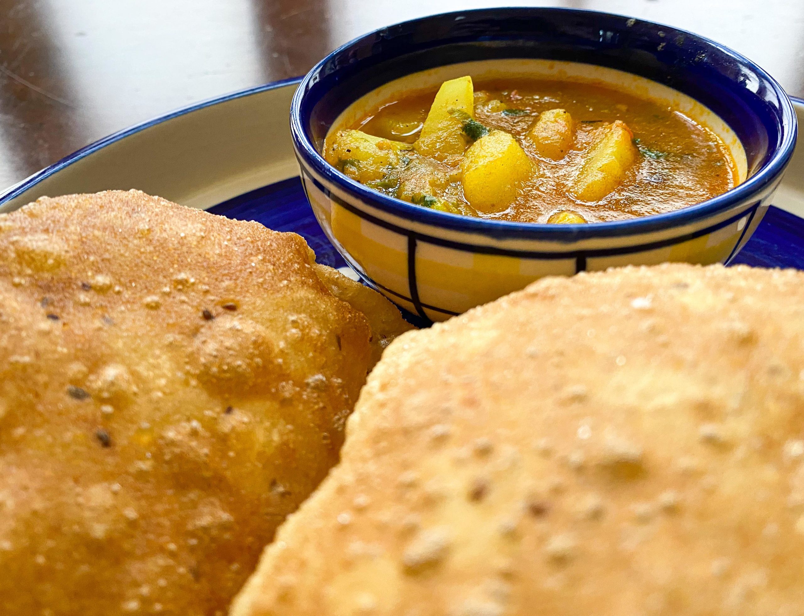 A popular North Indian brunch! Aloo Puri!! (Potato curry with a fried ...