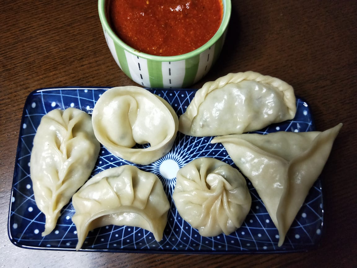 Darjeeling style chicken momo showing different styles of folds ...