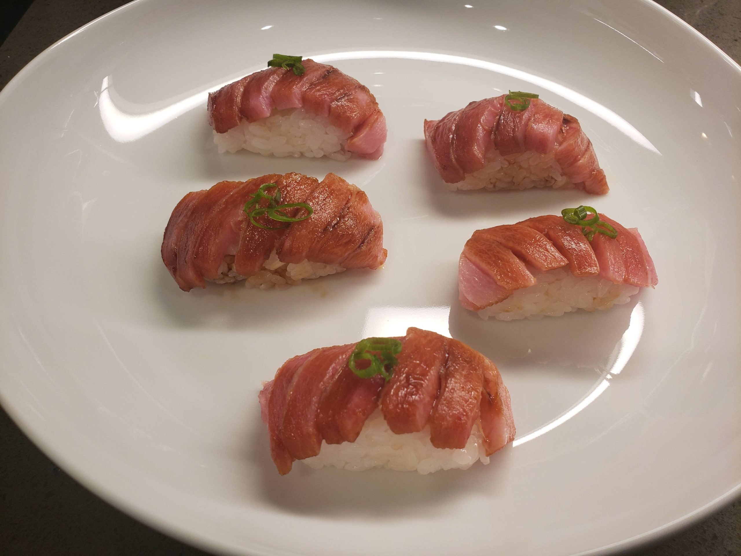 2nd time making sushi at home - some tuna nigiri with nikiri and green ...