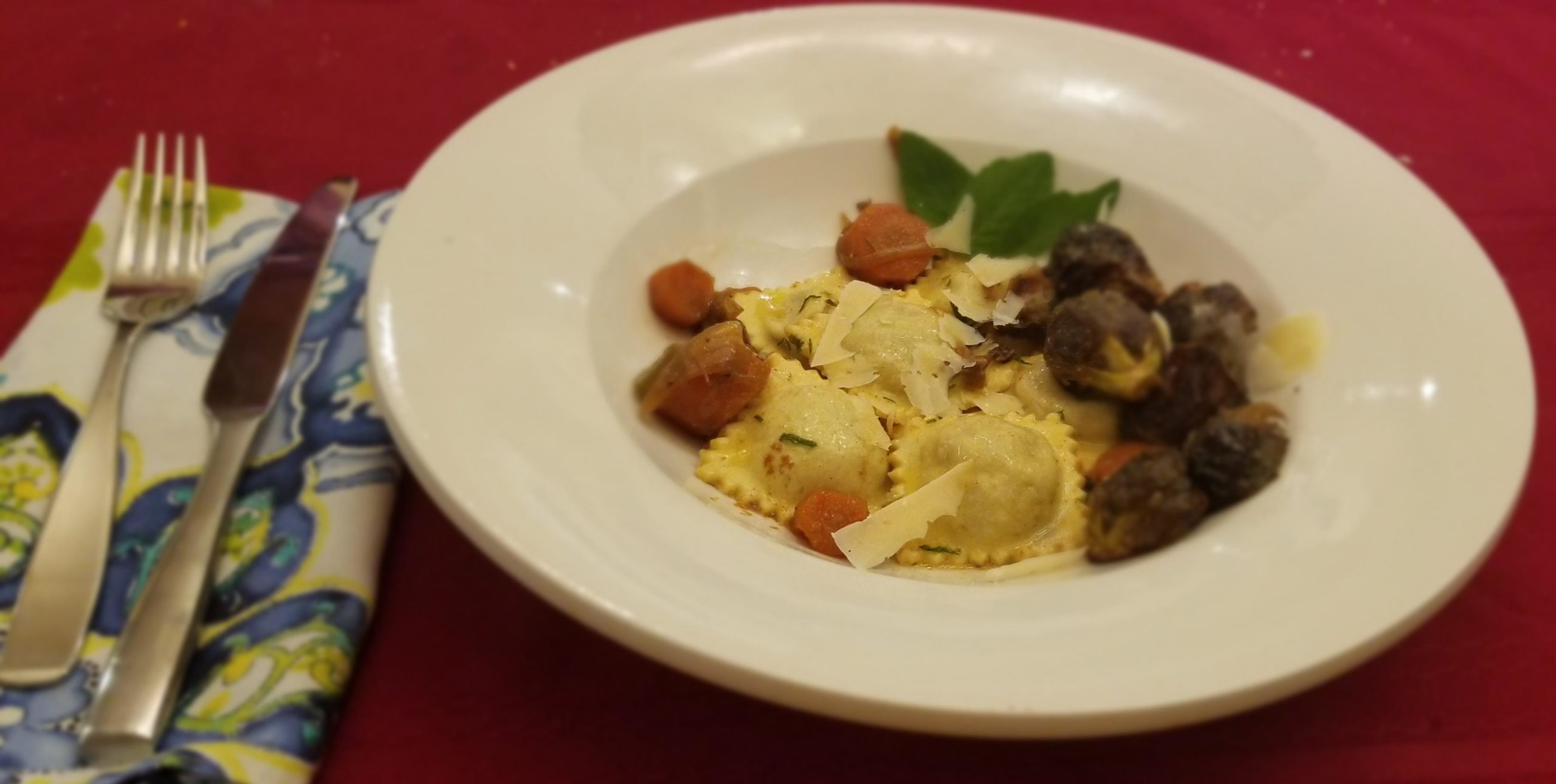 Braised short rib ravioli in brown butter sage sauce and brussel ...
