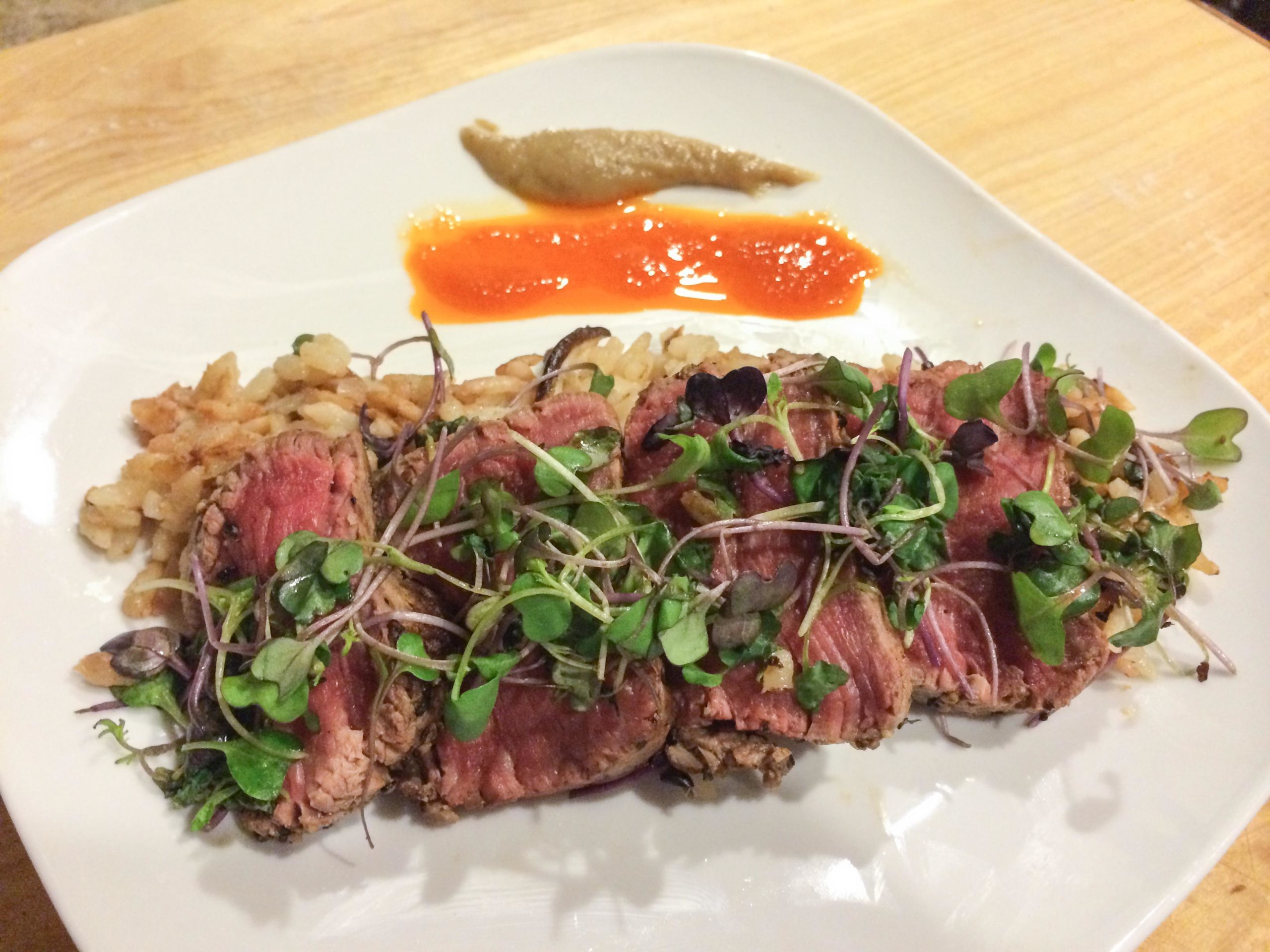 First time posting. Sliced filet mignon, shitake risotto, chili oil ...