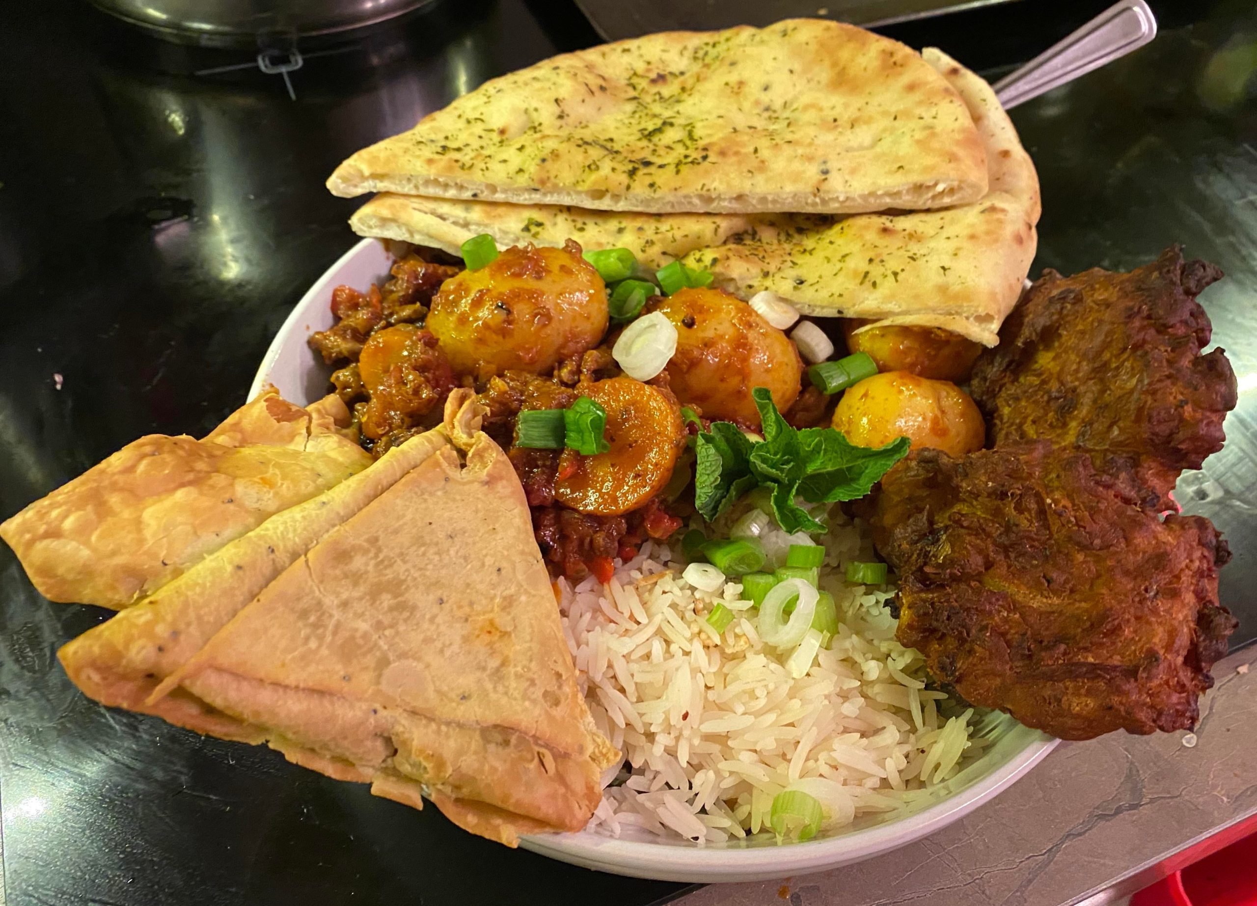 Beef rogan josh, vegetable samosa, onion bhaji, naan bread - Dining and ...