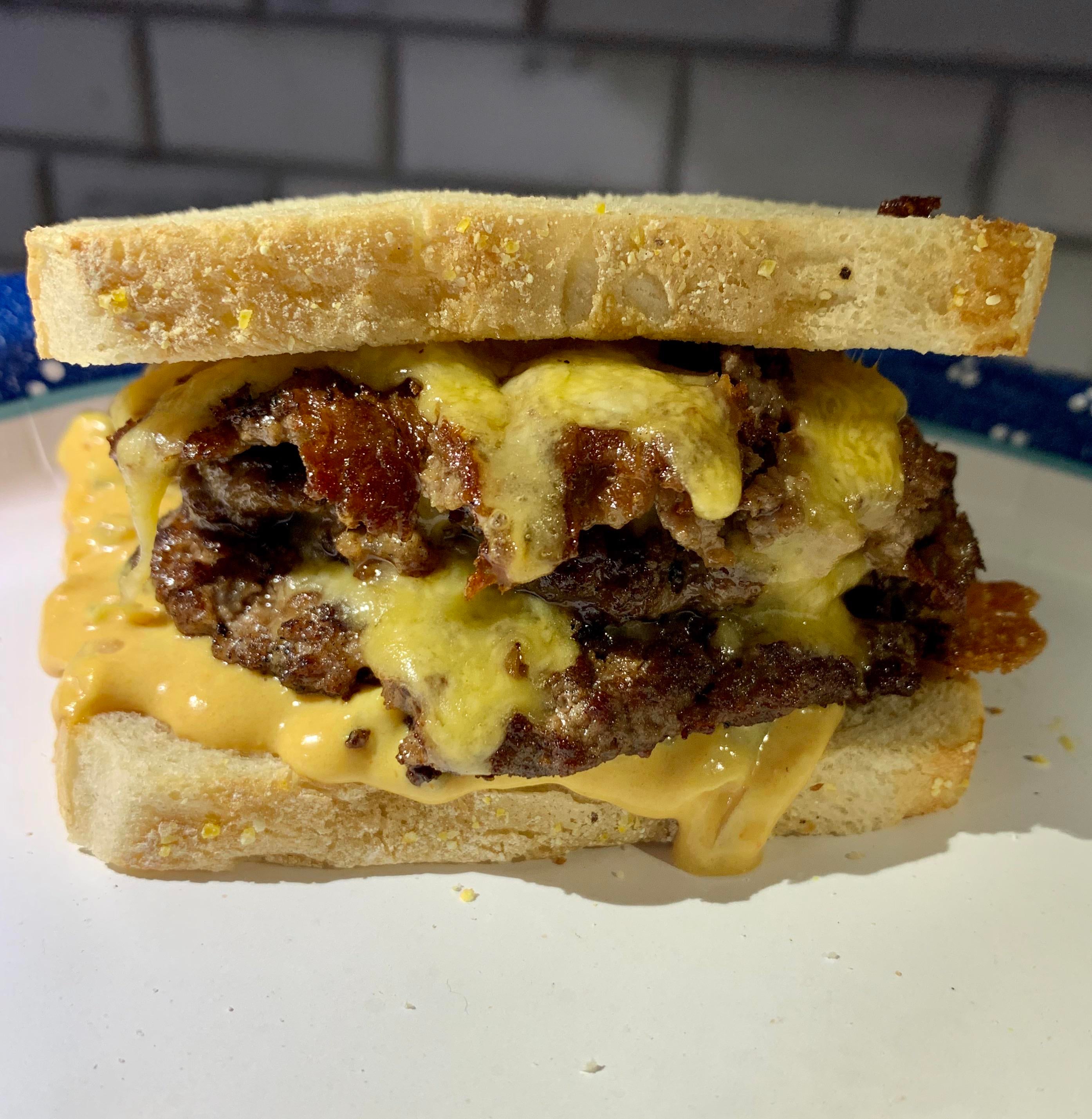 Triple-2oz-patty smasher on English toasting bread, cheddar & special🆘 ...