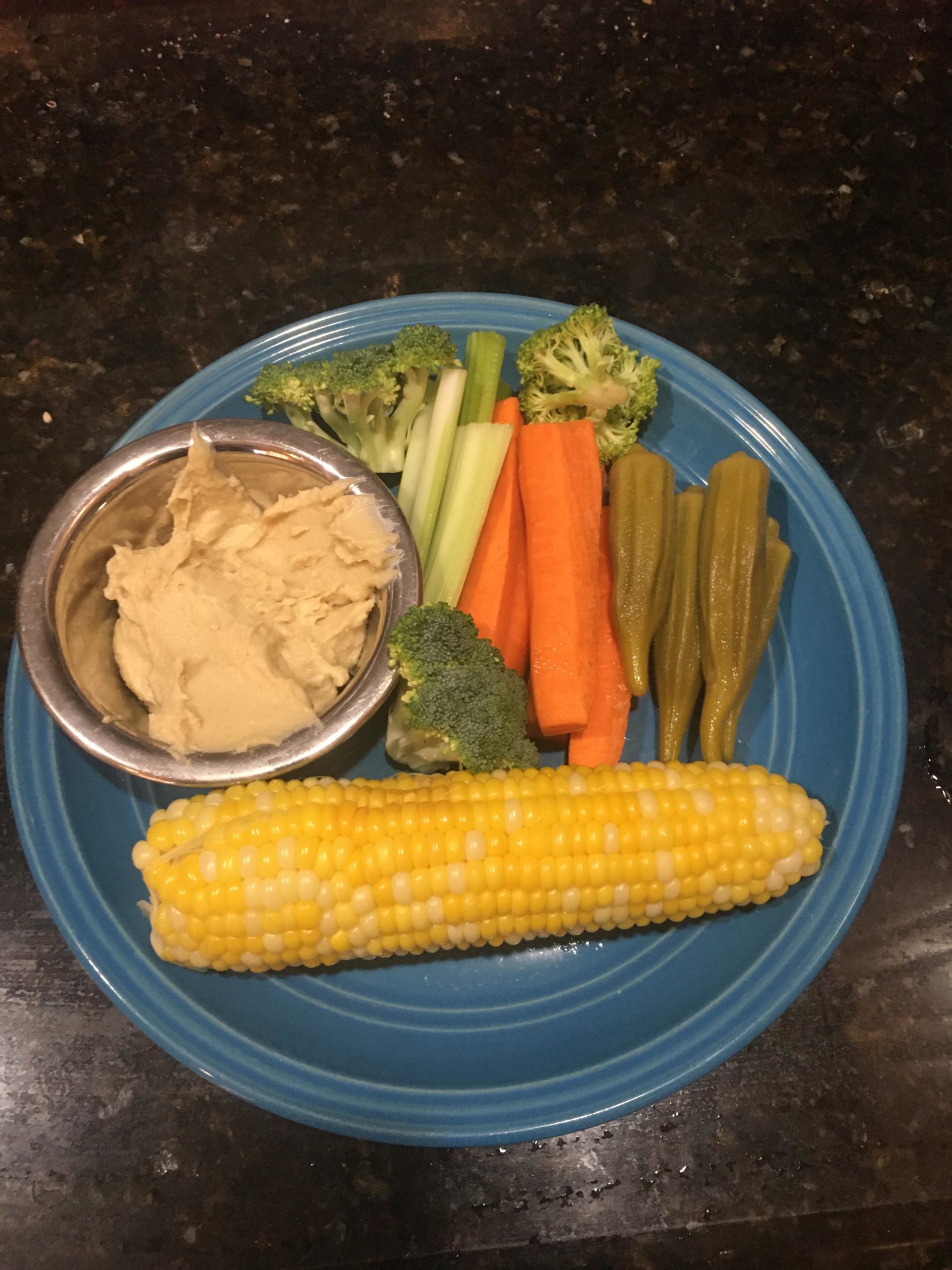 Corn on the cob, celery, carrots, broccoli, pickled okra, and hummus ...