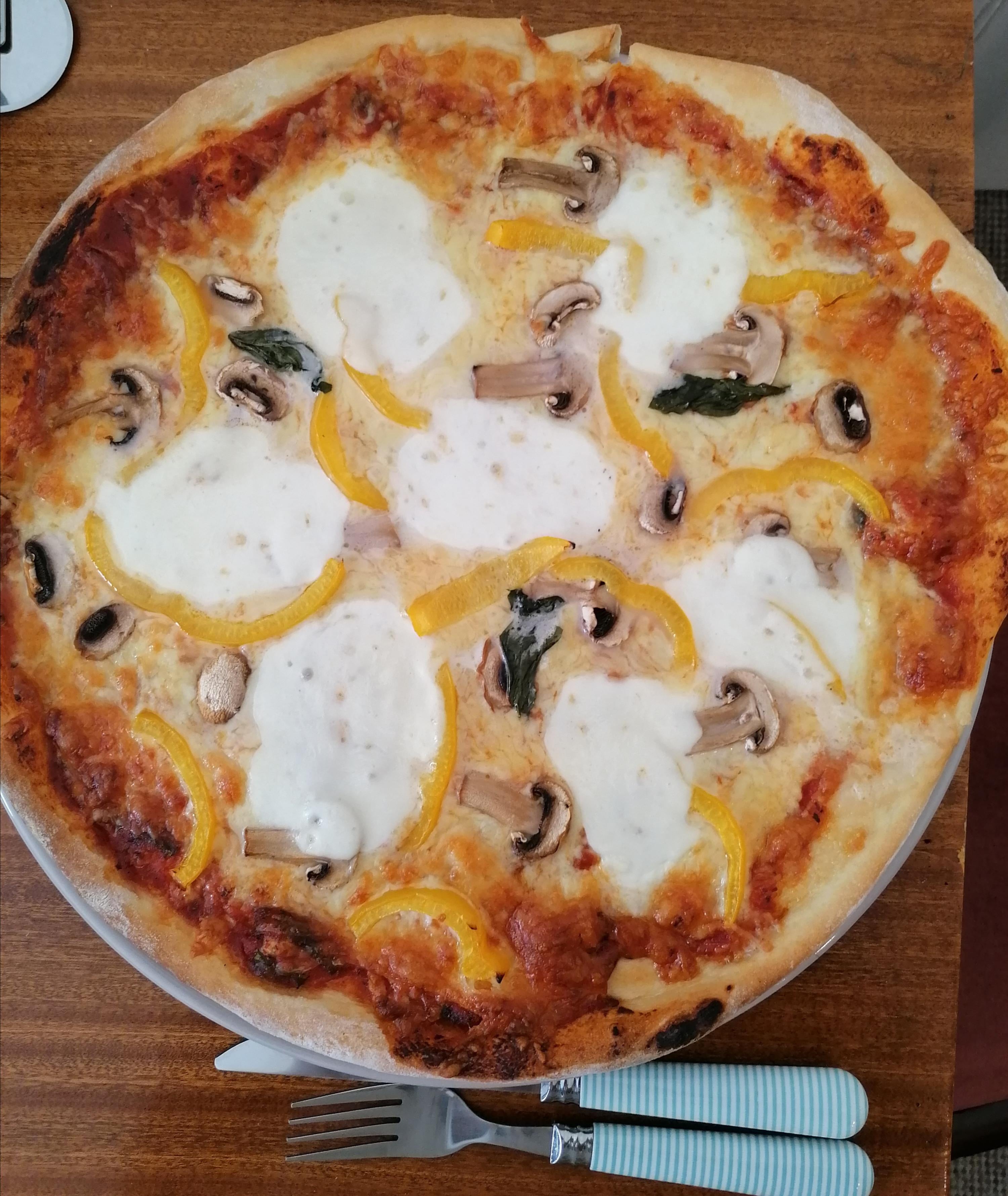 Third time making pizza. I like to think I'm getting better at it ...