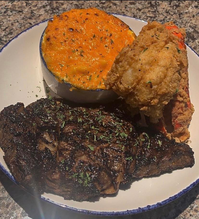 Beautiful ribeye with fried lobster and Mac n cheese for my dads ...