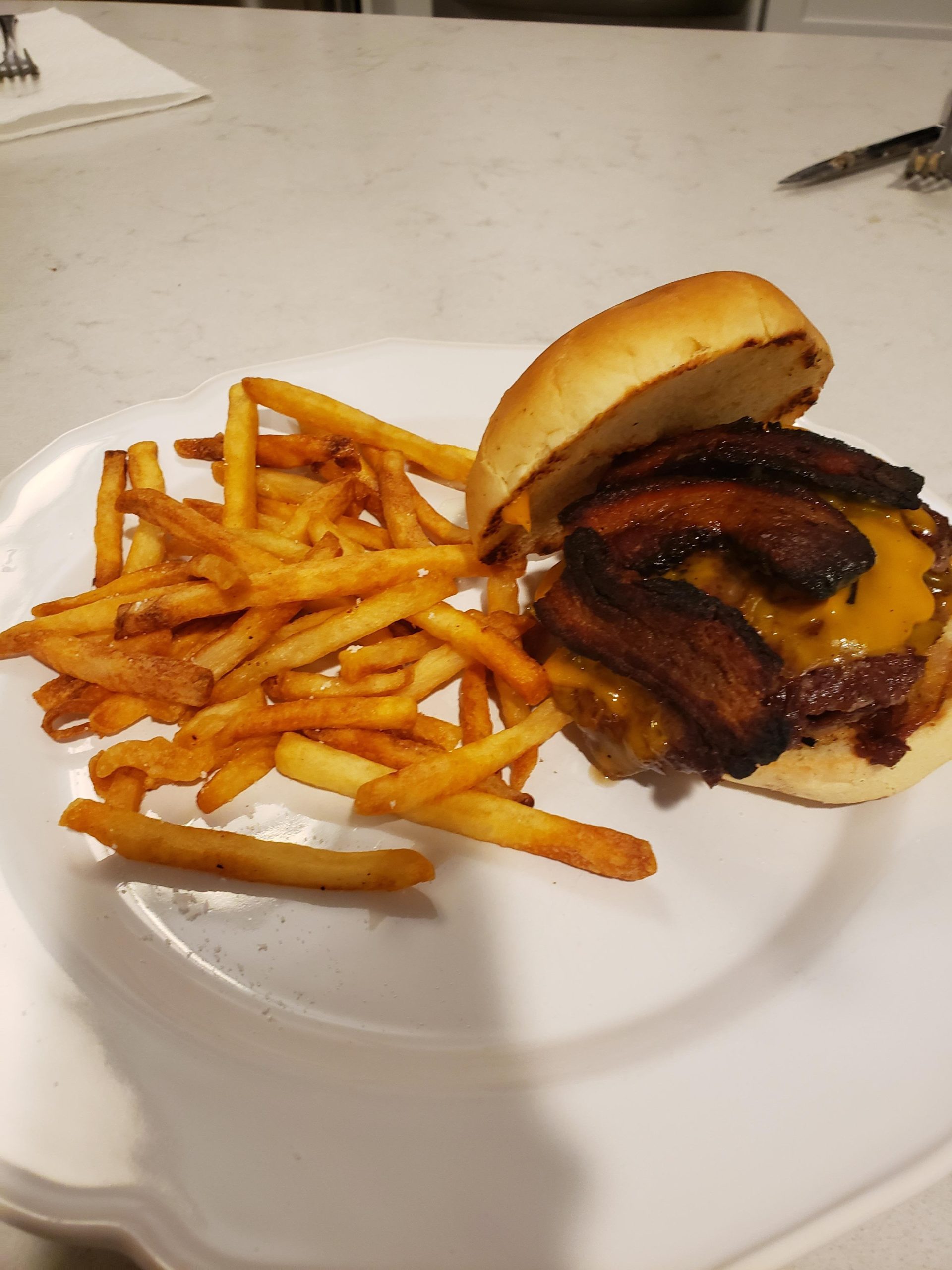 Double smashed burger with thick cut bacon and homemade carmelized ...