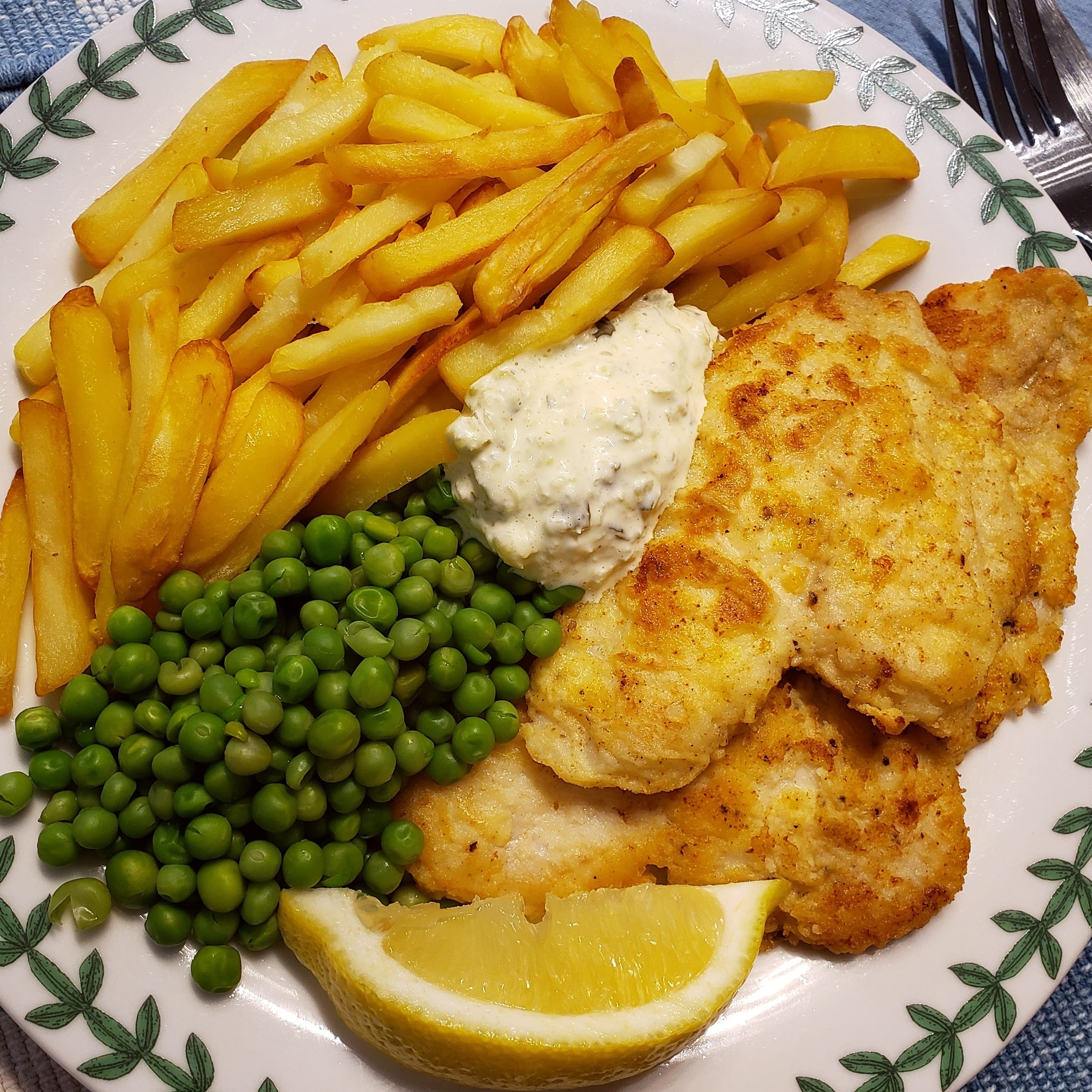 Sole fillets pan fried in butter, serve with fries, peas, and homemade ...