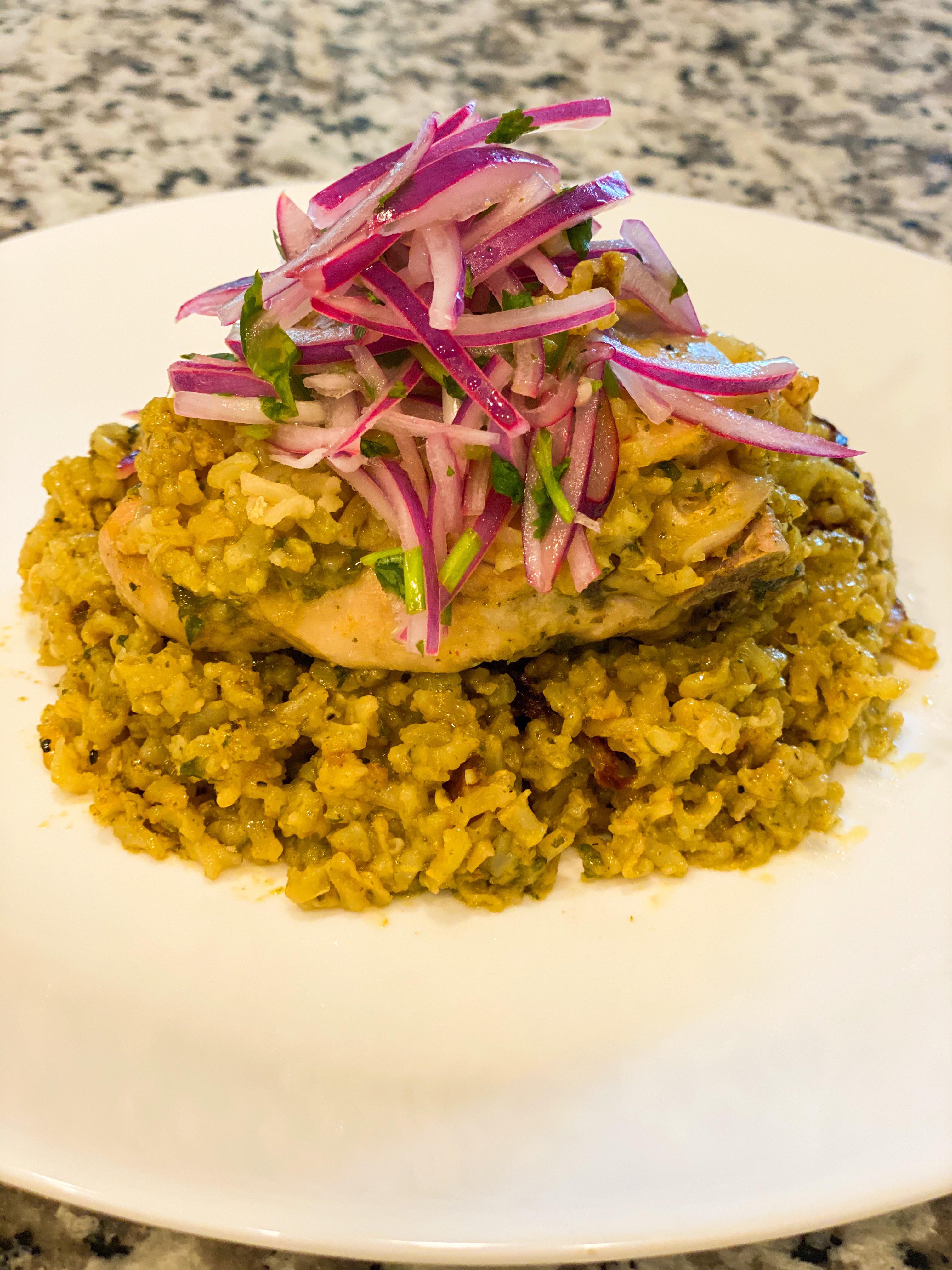 Peruvian arroz con pollo topped with salsa criolla - Dining and Cooking
