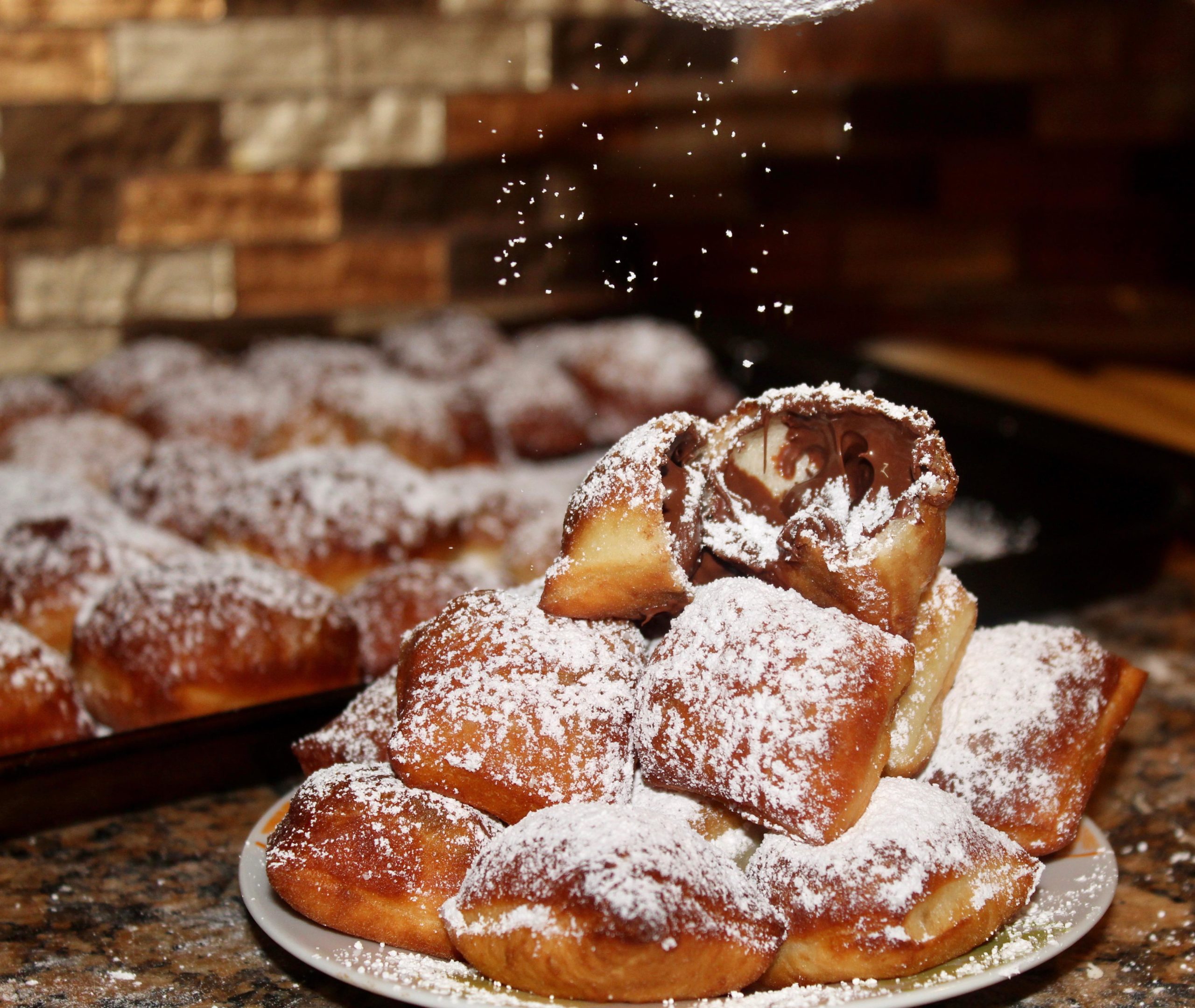 Beignets! Some filled with chocolate, some with jam, into my mouth I ...