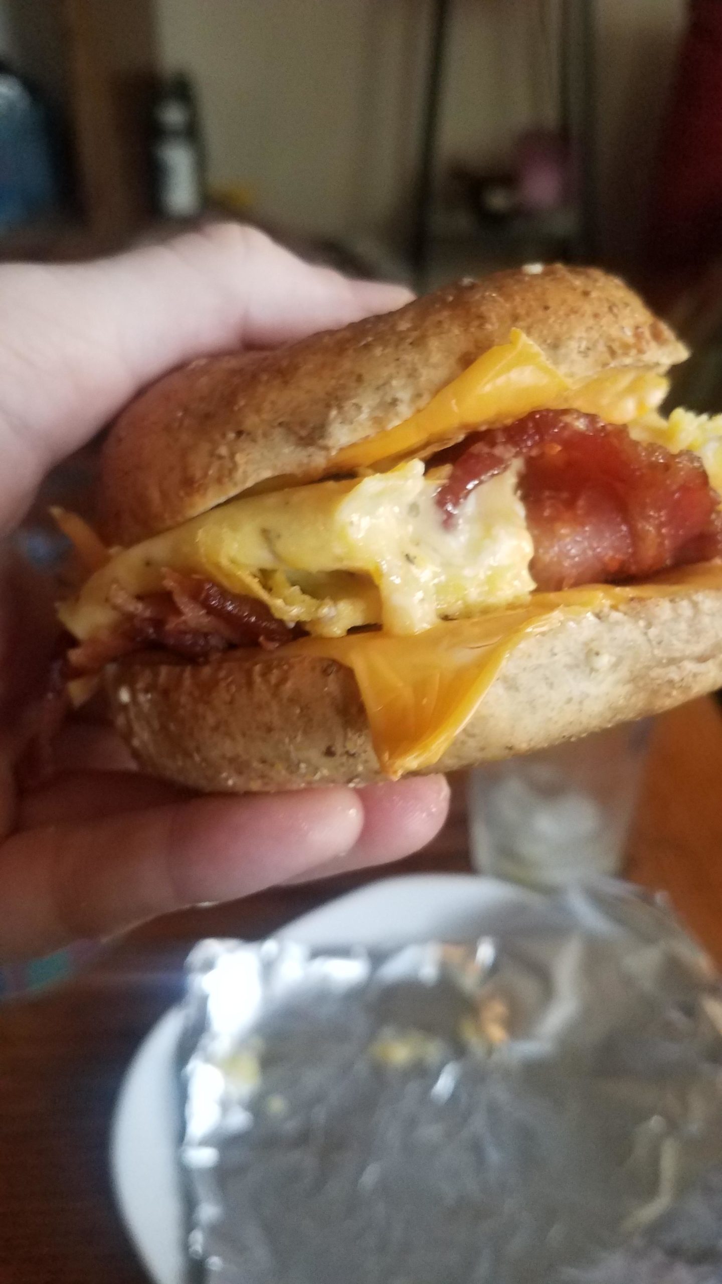 Simple breakfast sammich. Folded scrambled egg, bacon, sharp cheddar ...