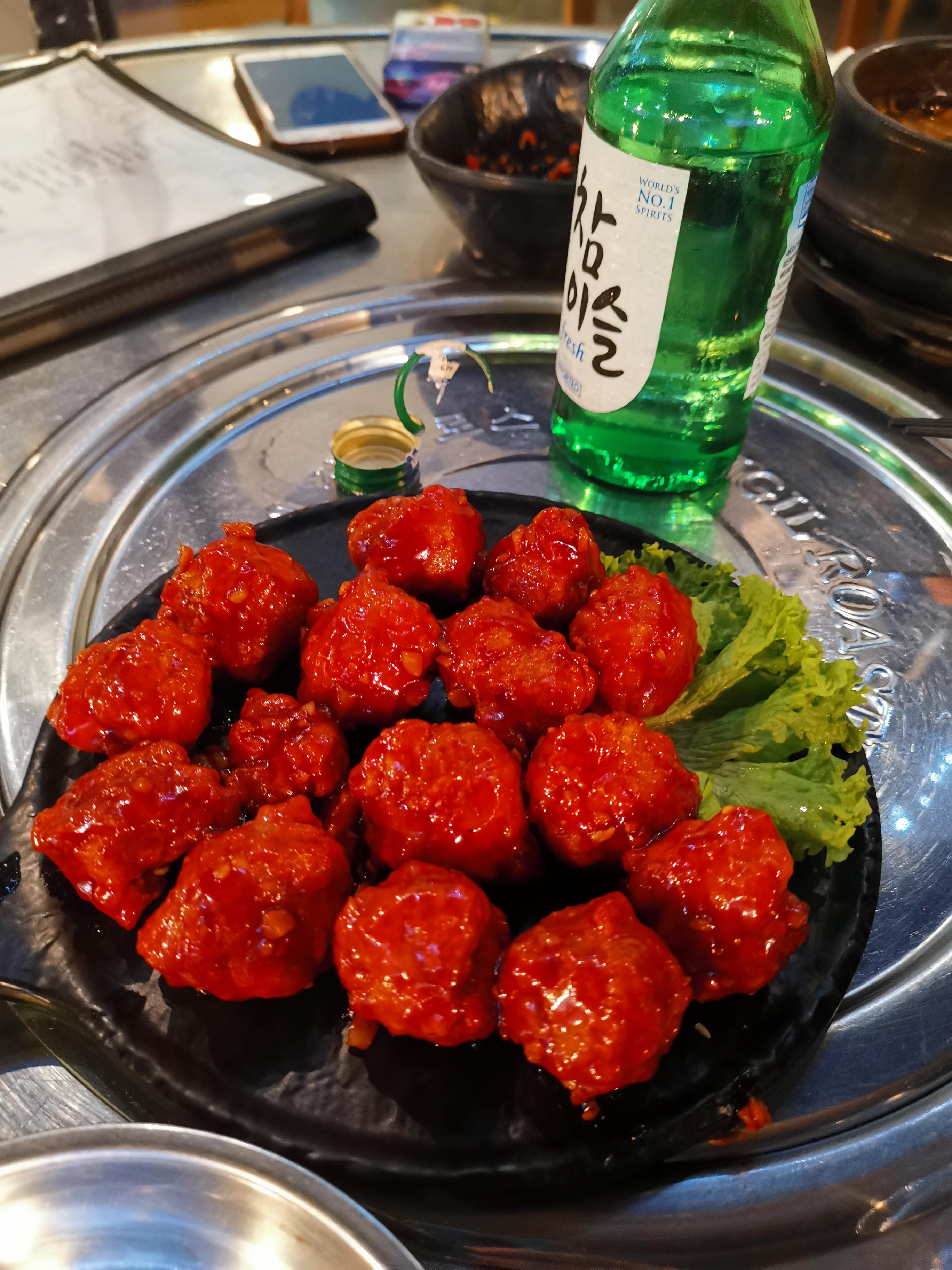 Korean spicy fried chicken paired with soju. - Dining and Cooking