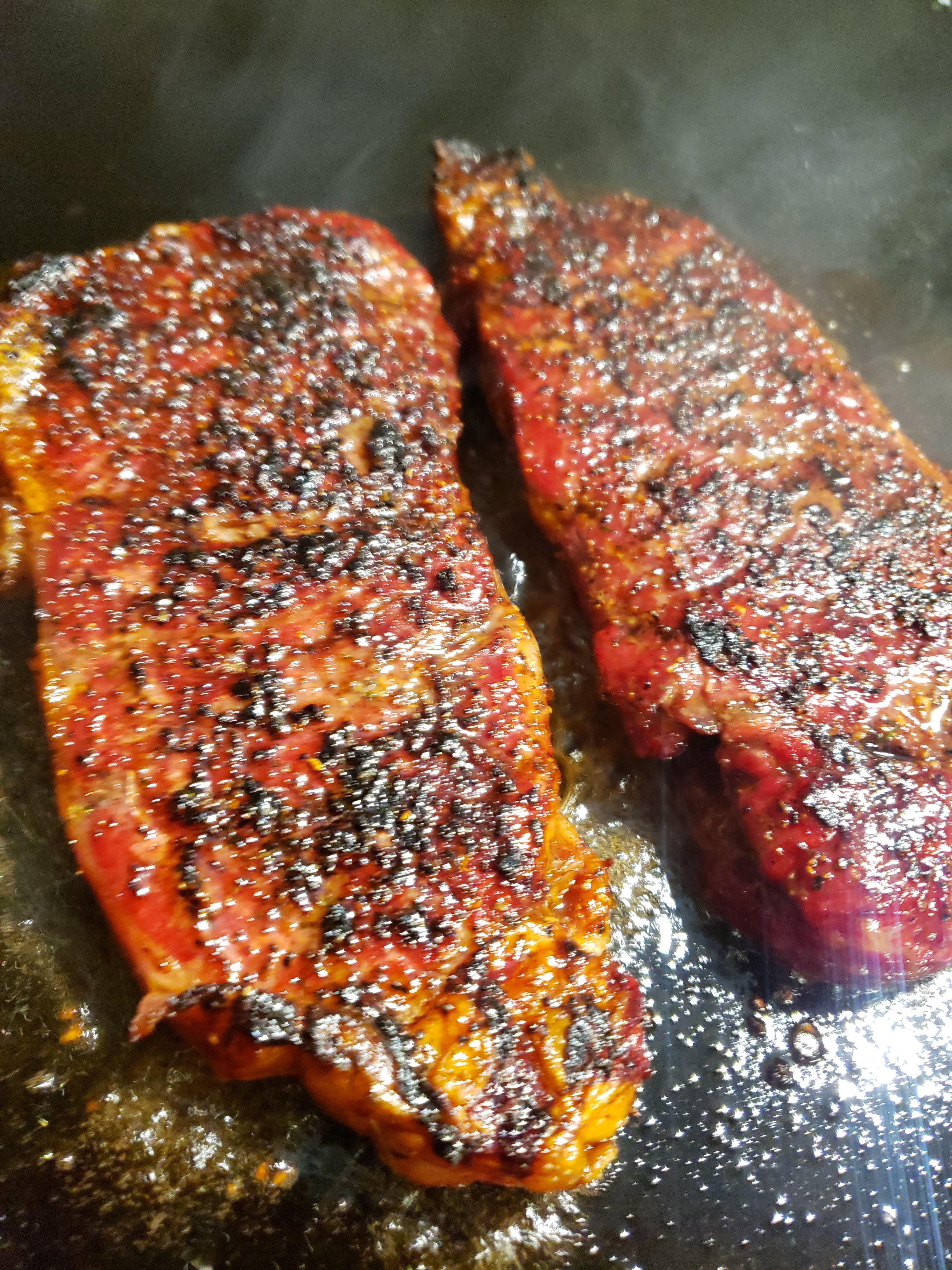 Ny strips reverse seared and butter basted. Finishing on the blackstone ...