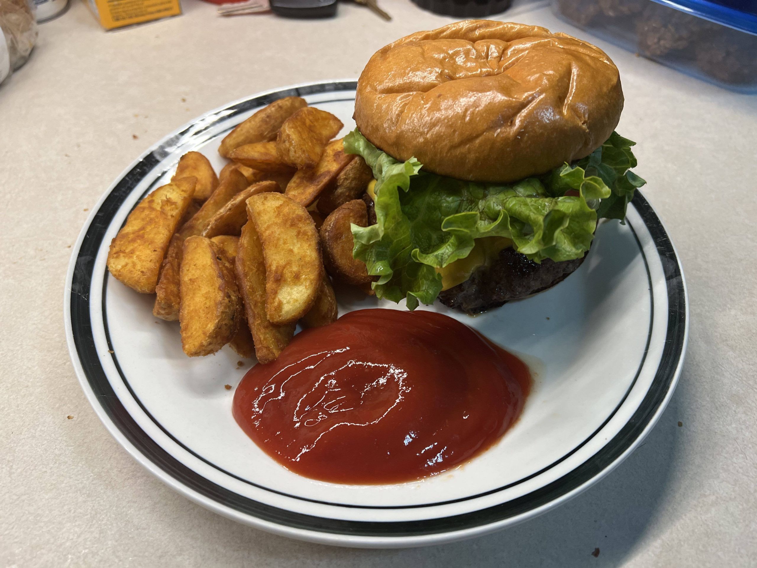 Homemade cheeseburger and wedge fries - Dining and Cooking