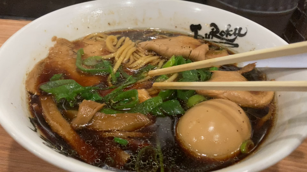Pulling great noodles out of dark shoyu ramen at Jouroku in Osaka ...