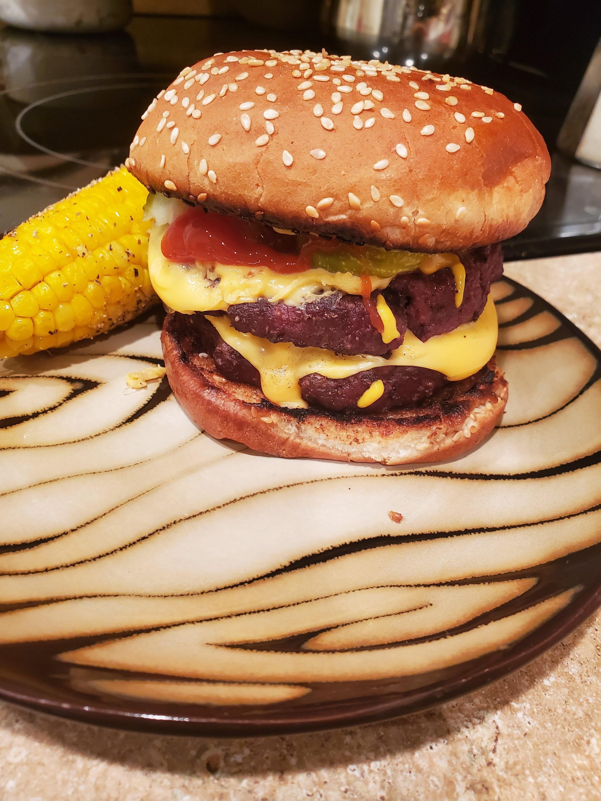 Half pound burger with grilled corn - Dining and Cooking