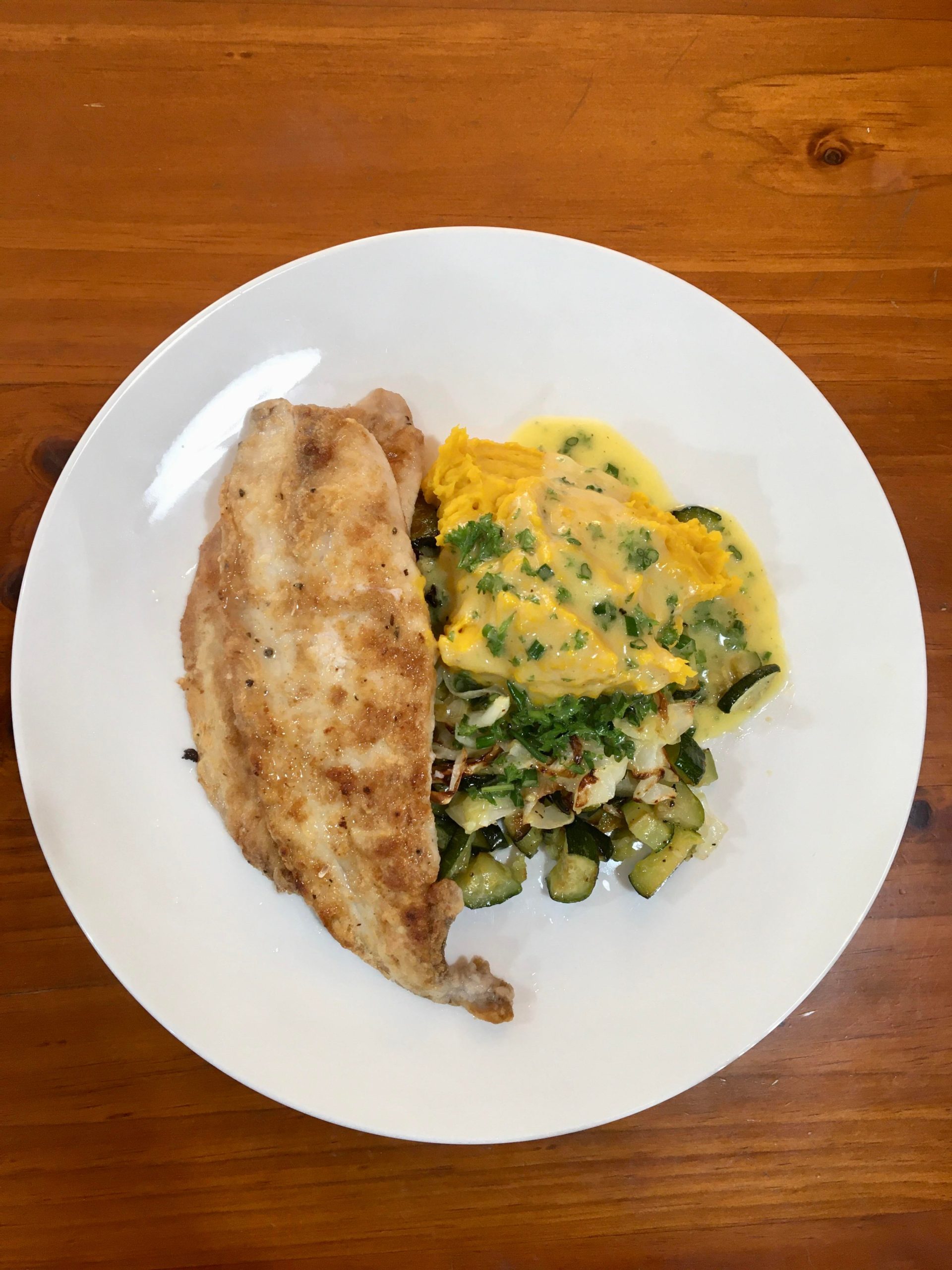 Pan fried trevally, garlic roasted cabbage and courgette, pumpkin mash ...