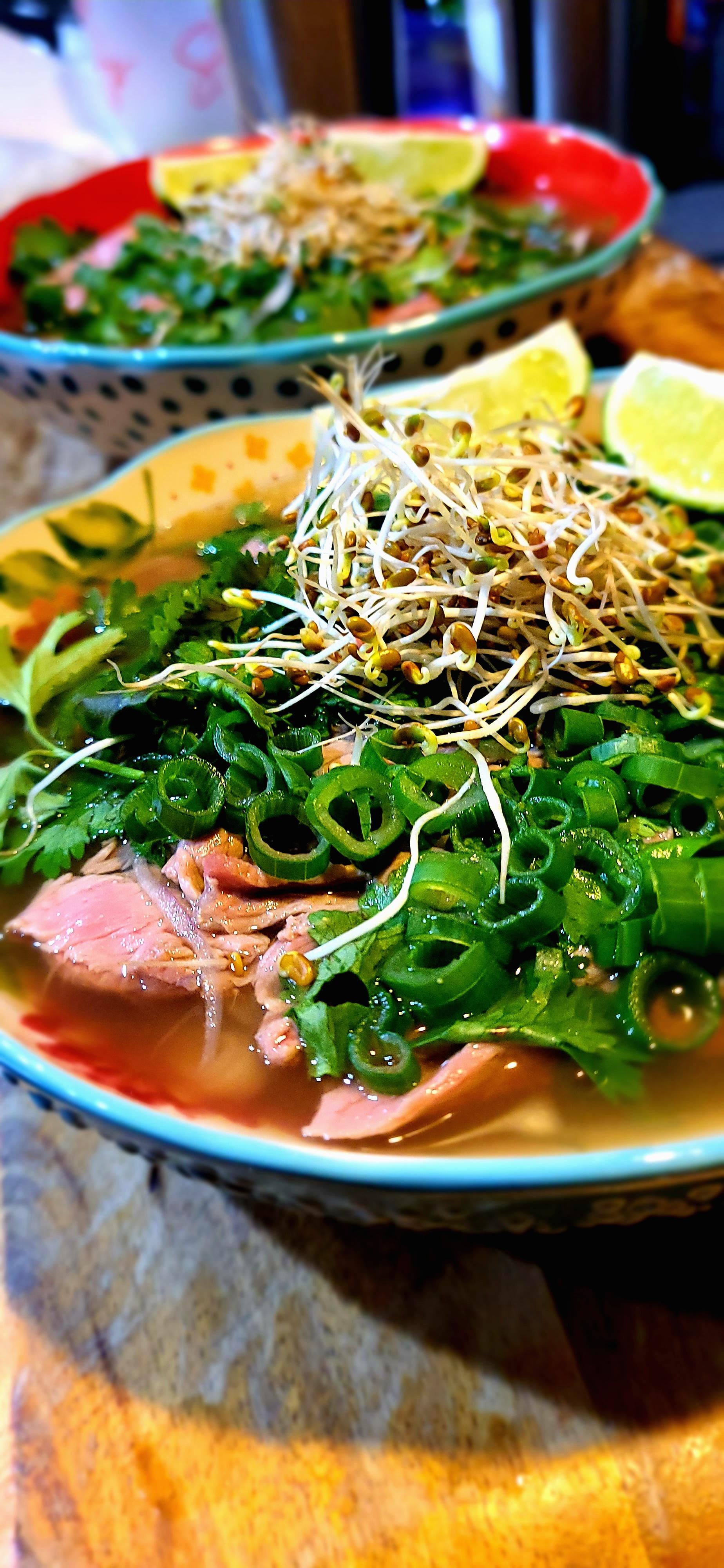 Homemade beef pho with alfalfa sprouts, cilantro, scallions, and ...