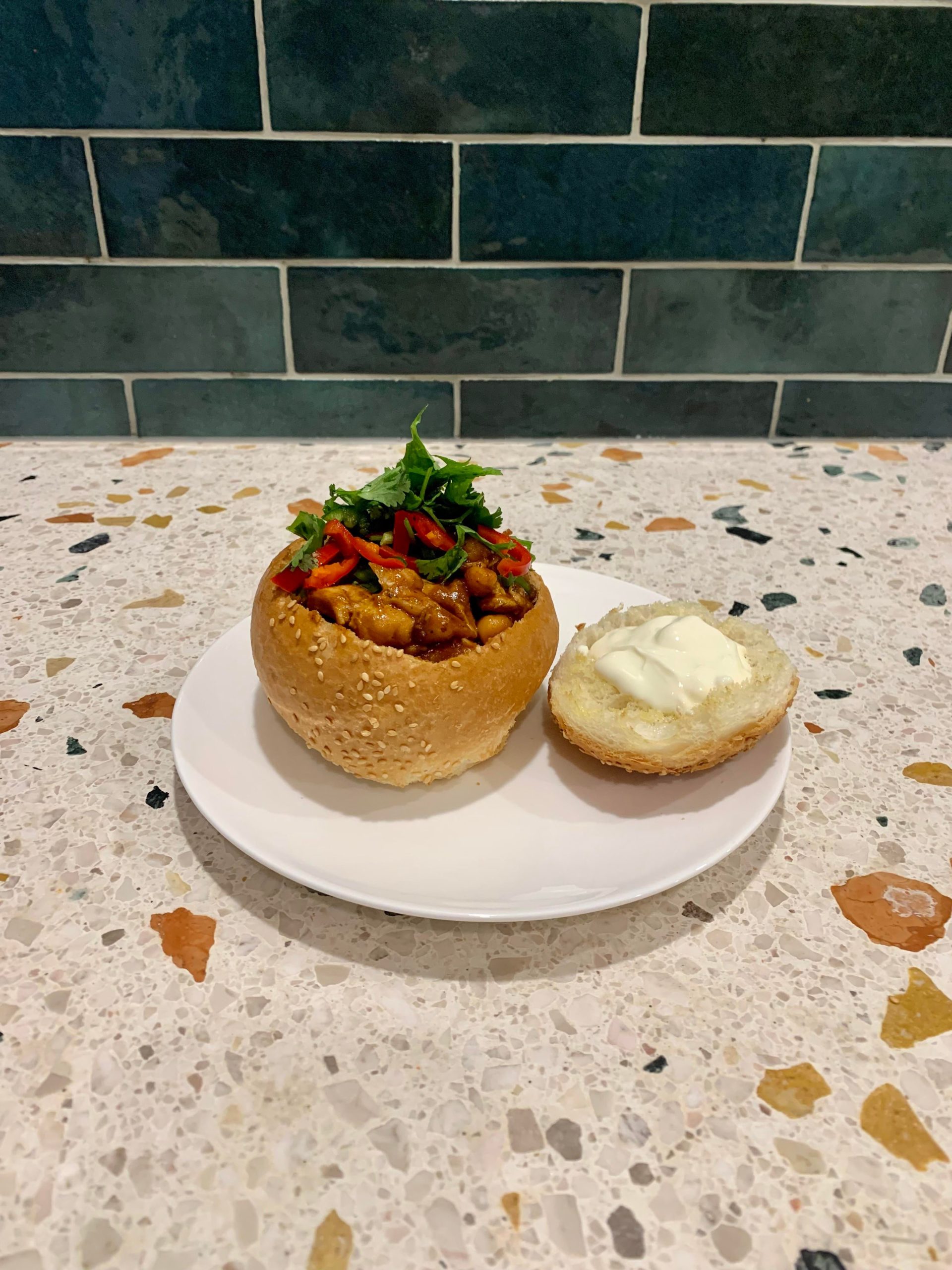 Bunny Chow: chicken and chickpea curry in a bread roll topped with ...