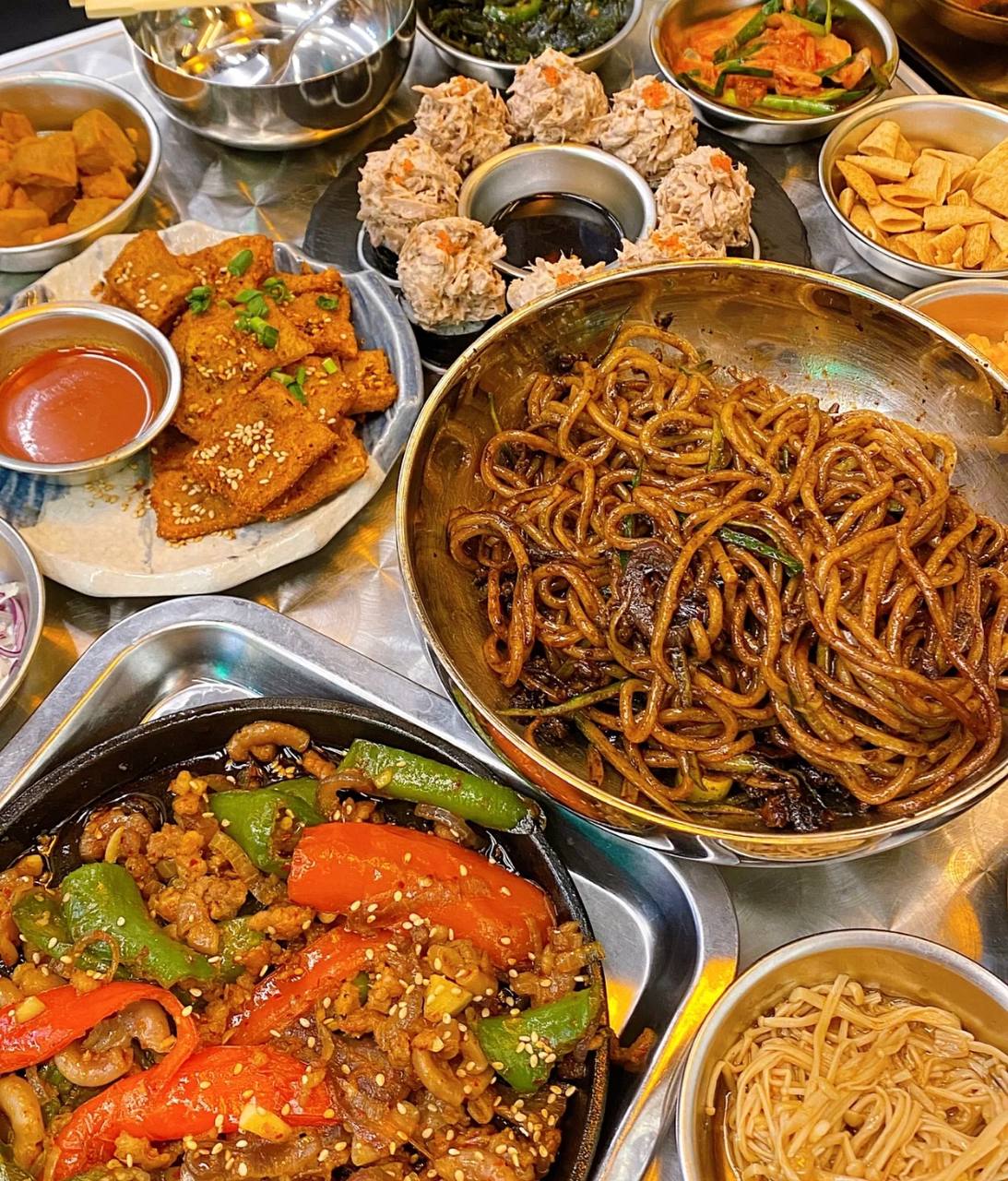 Traditional jajang noodles, tuna rice balls, grilled pork intestines on ...