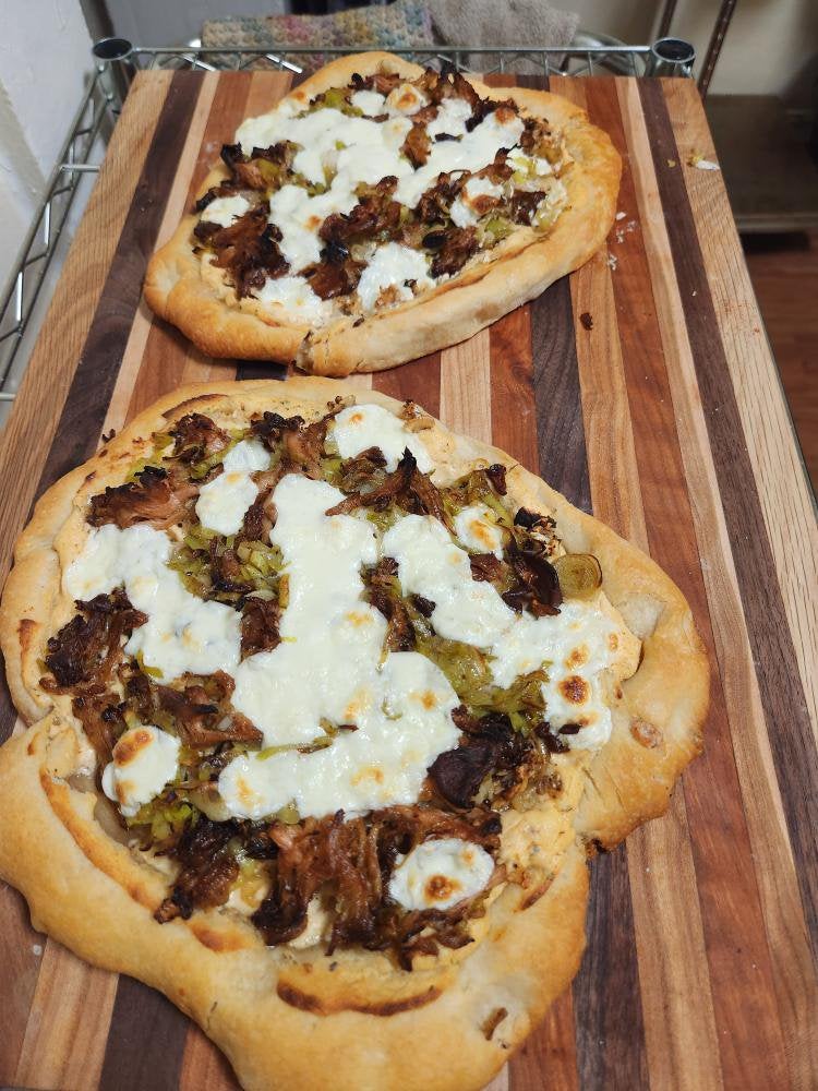 Wild mushroom and leek bianco pizza with cubes of lardo in the dough ...