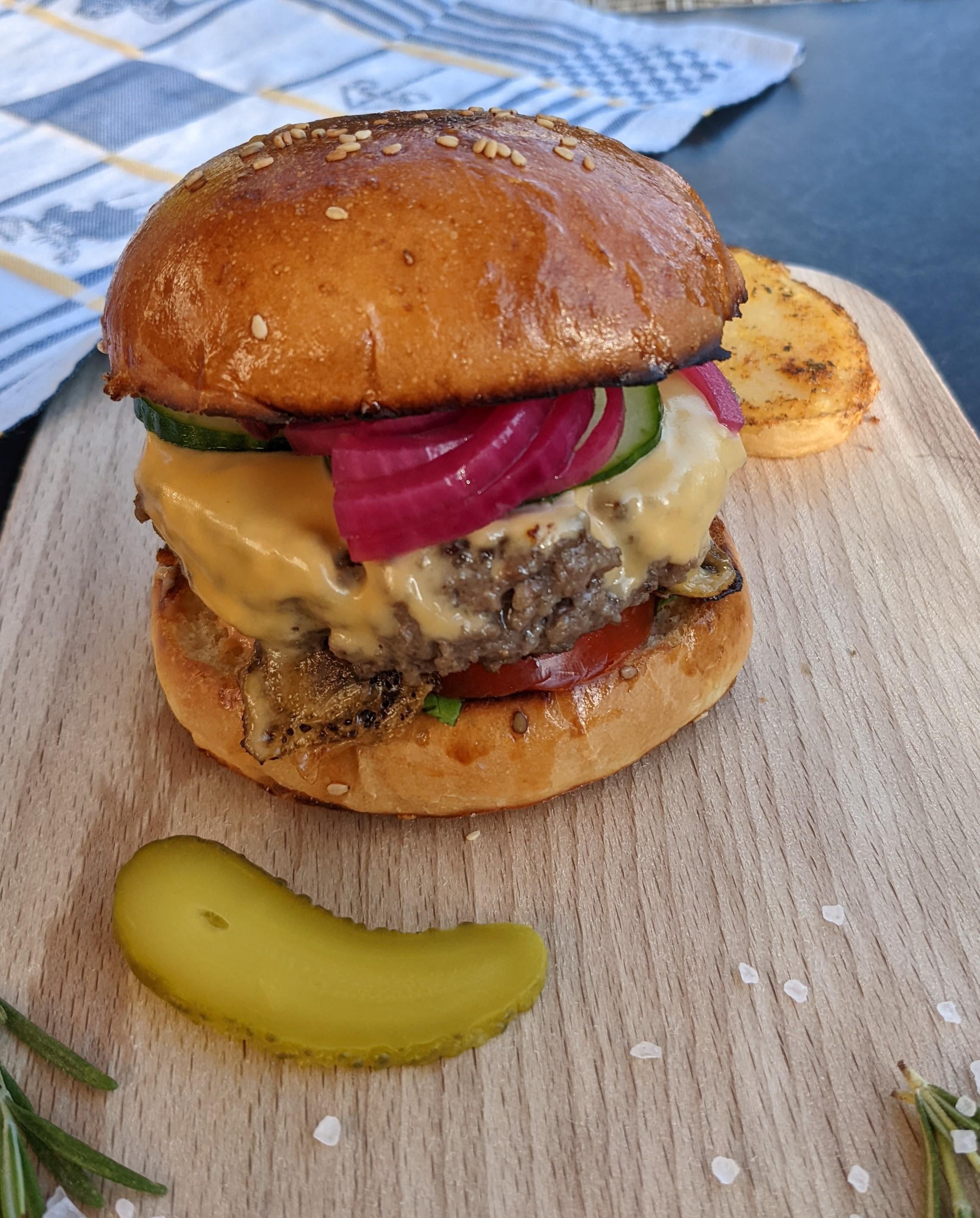 homemade brioche bun with pickled red onion, tomato and cucumber ...