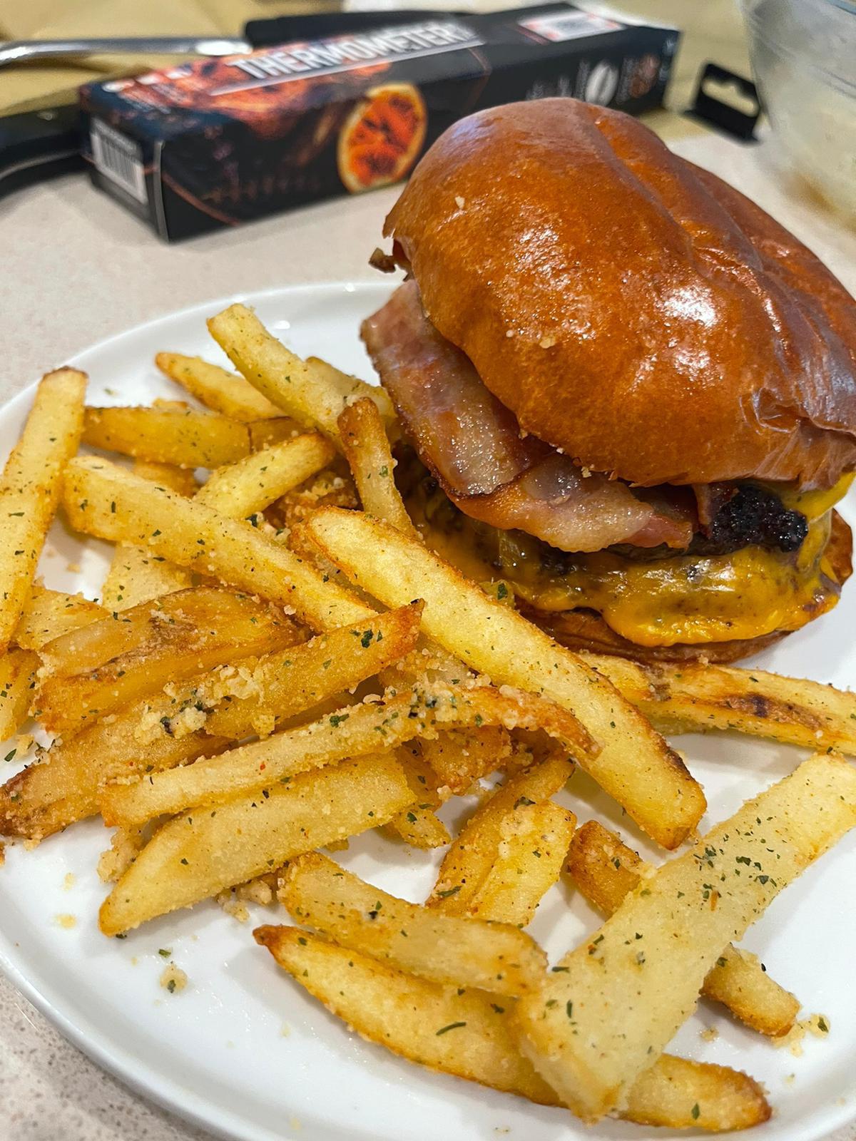 Made a smash burger on a brioche bun with homemade garlic parm fries ...