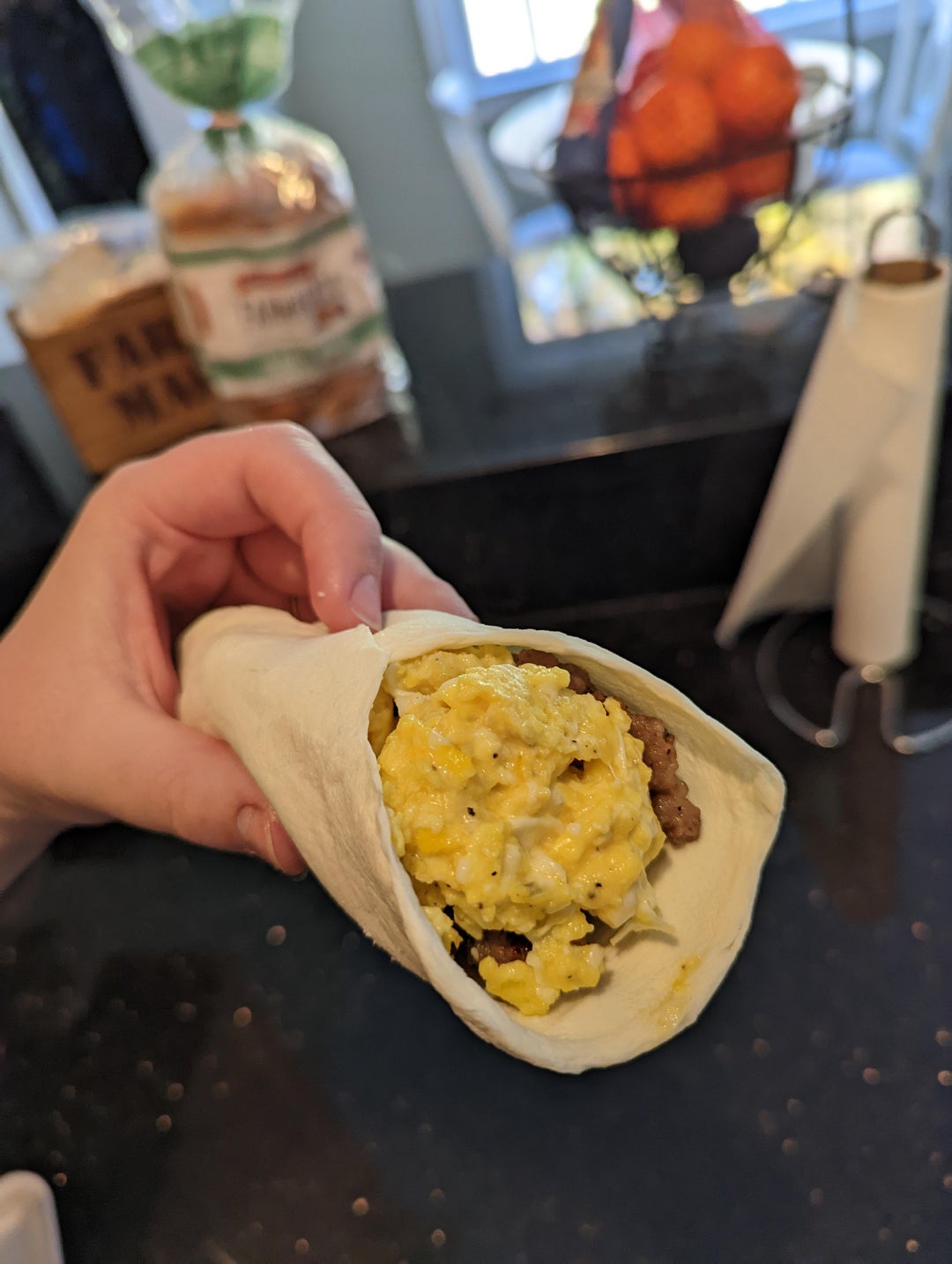 500 calorie breakfast wrap. scrambled eggs, sausage patty and cheese on ...