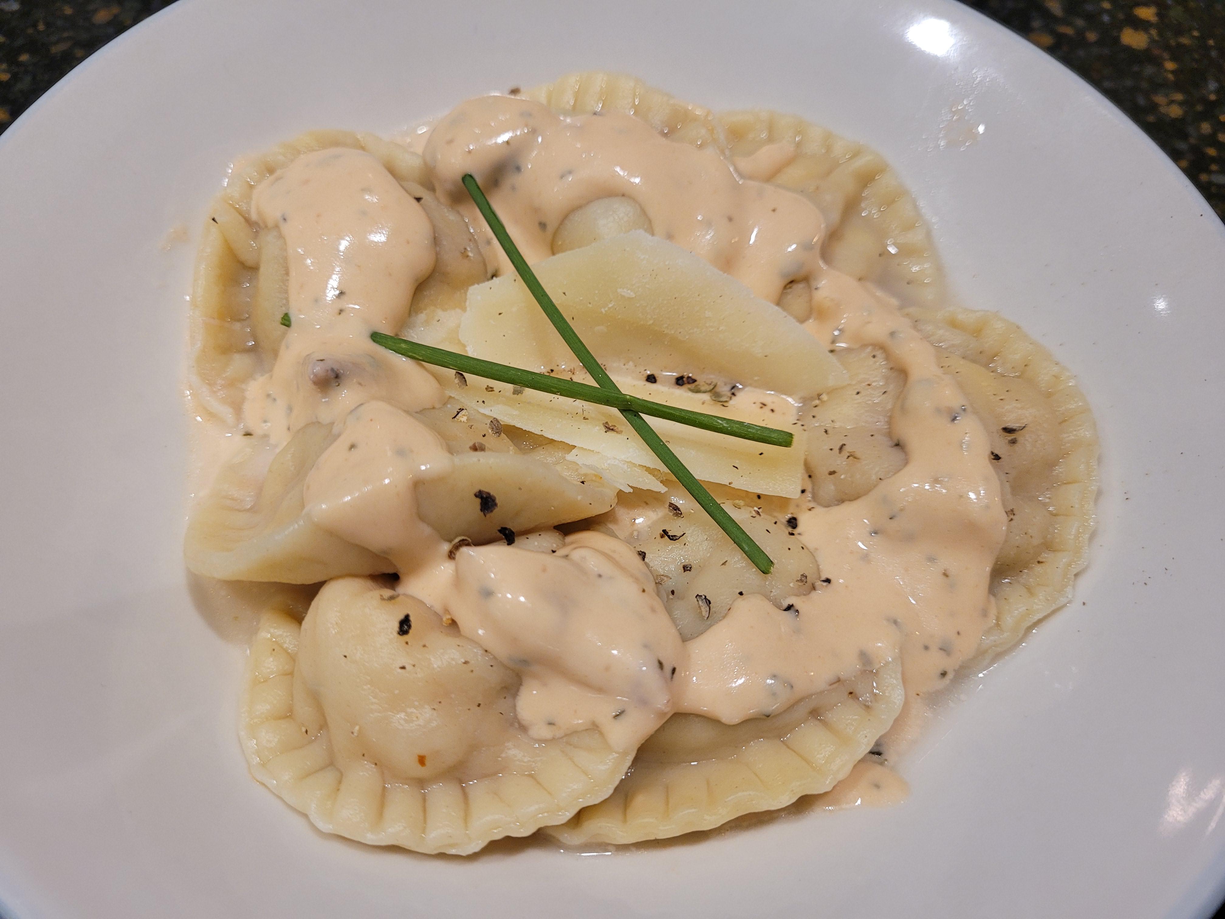 [OC] Homemade lobster and goat cheese ravioli with a rosé cream sauce ...