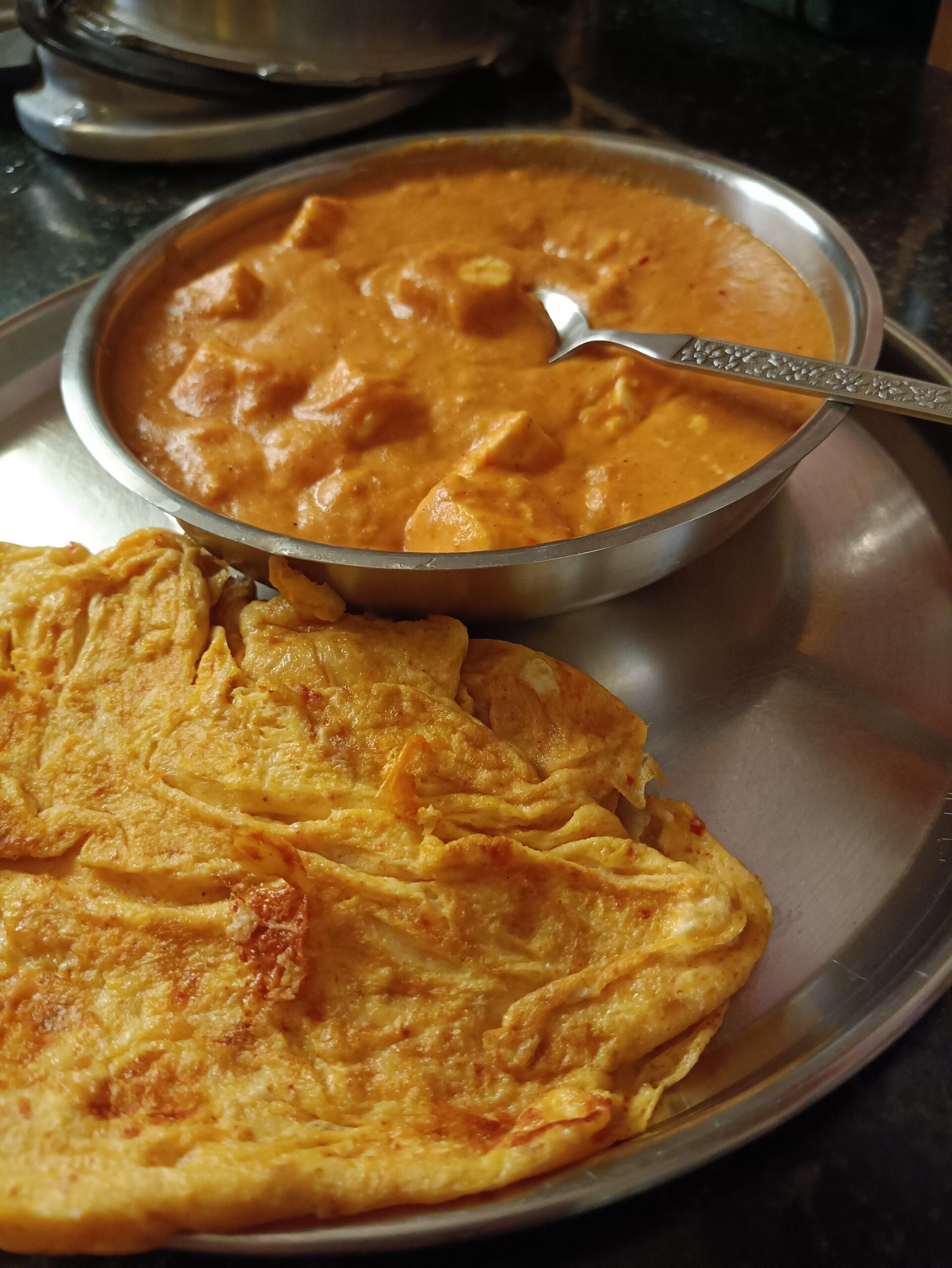 Butter chicken paneer with cheesy scrambled eggs - Dining and Cooking