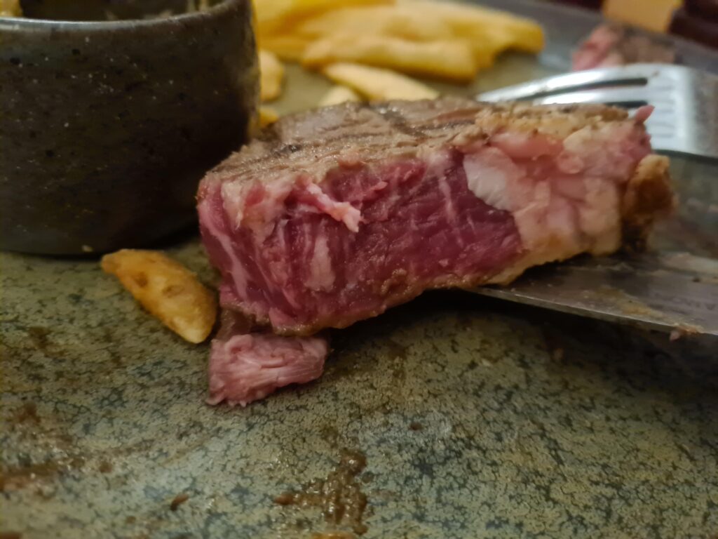 Is this rare? First time eating steak at a steak house. Girlfriend ...