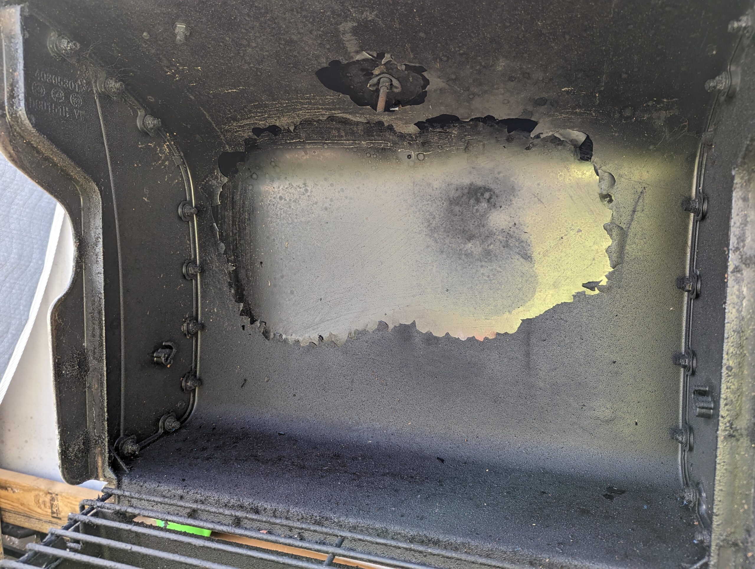 bought a second hand Weber spirit, is this peeling paint or carbonized ...