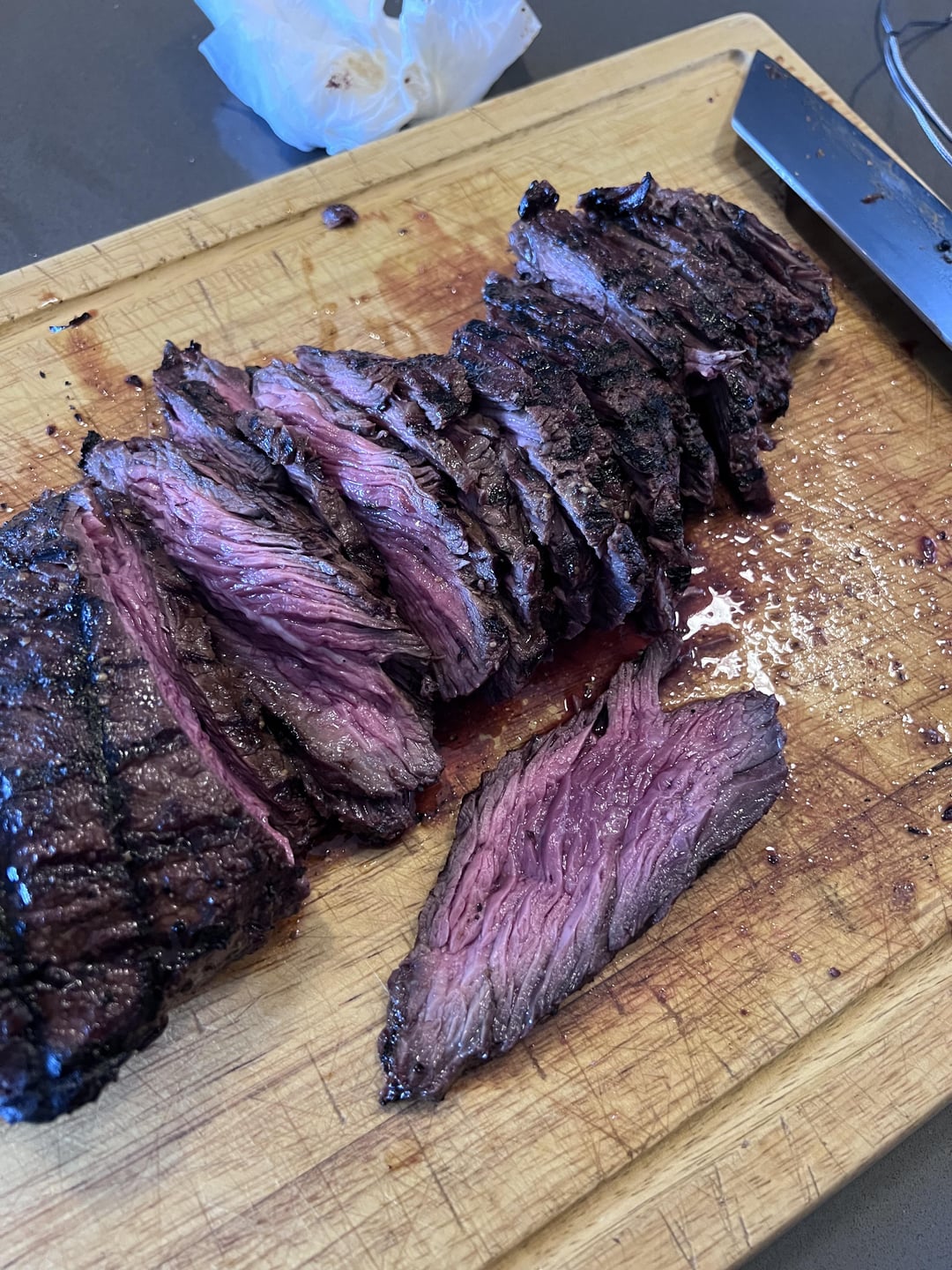Marinated bavette (flank) cooked on the BBQ, left side rare, right side ...