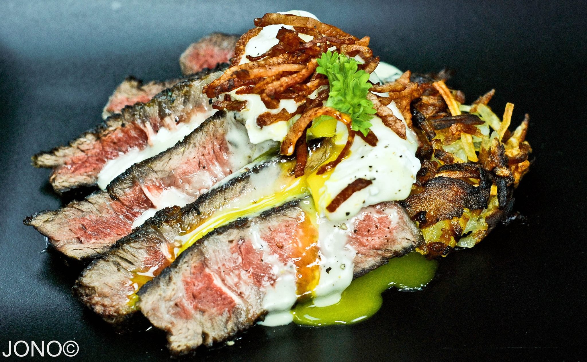 Steak & Eggs, Rosti, Jalapeno Queso, Crispy Bacon - Dining and Cooking