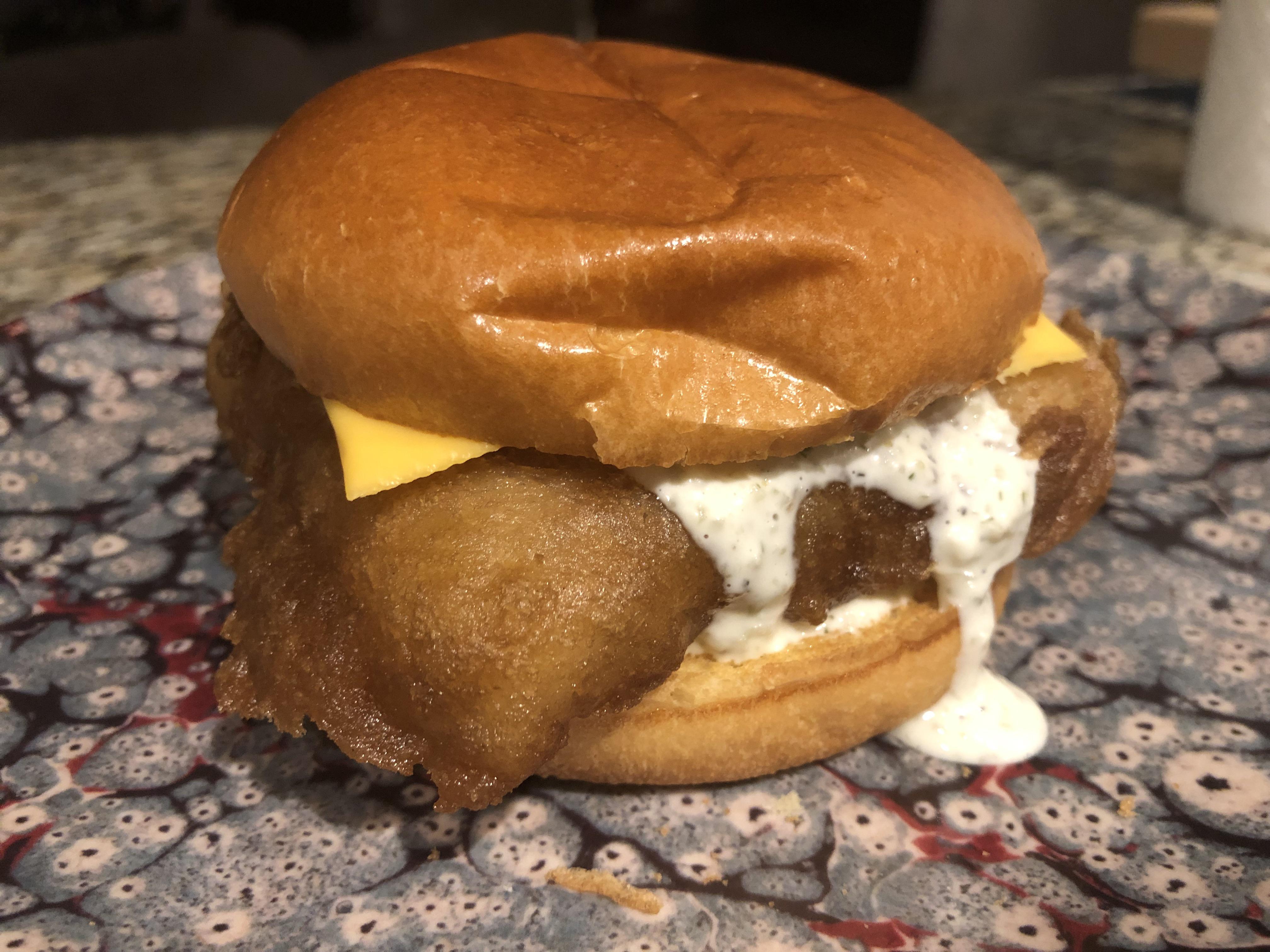 Homemade simple McD’s style fish sandwich. Battered cod, gubment cheese ...