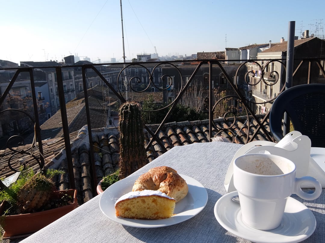 Simple breakfast on a rooftop terrace under Mediterranean winter sun ...