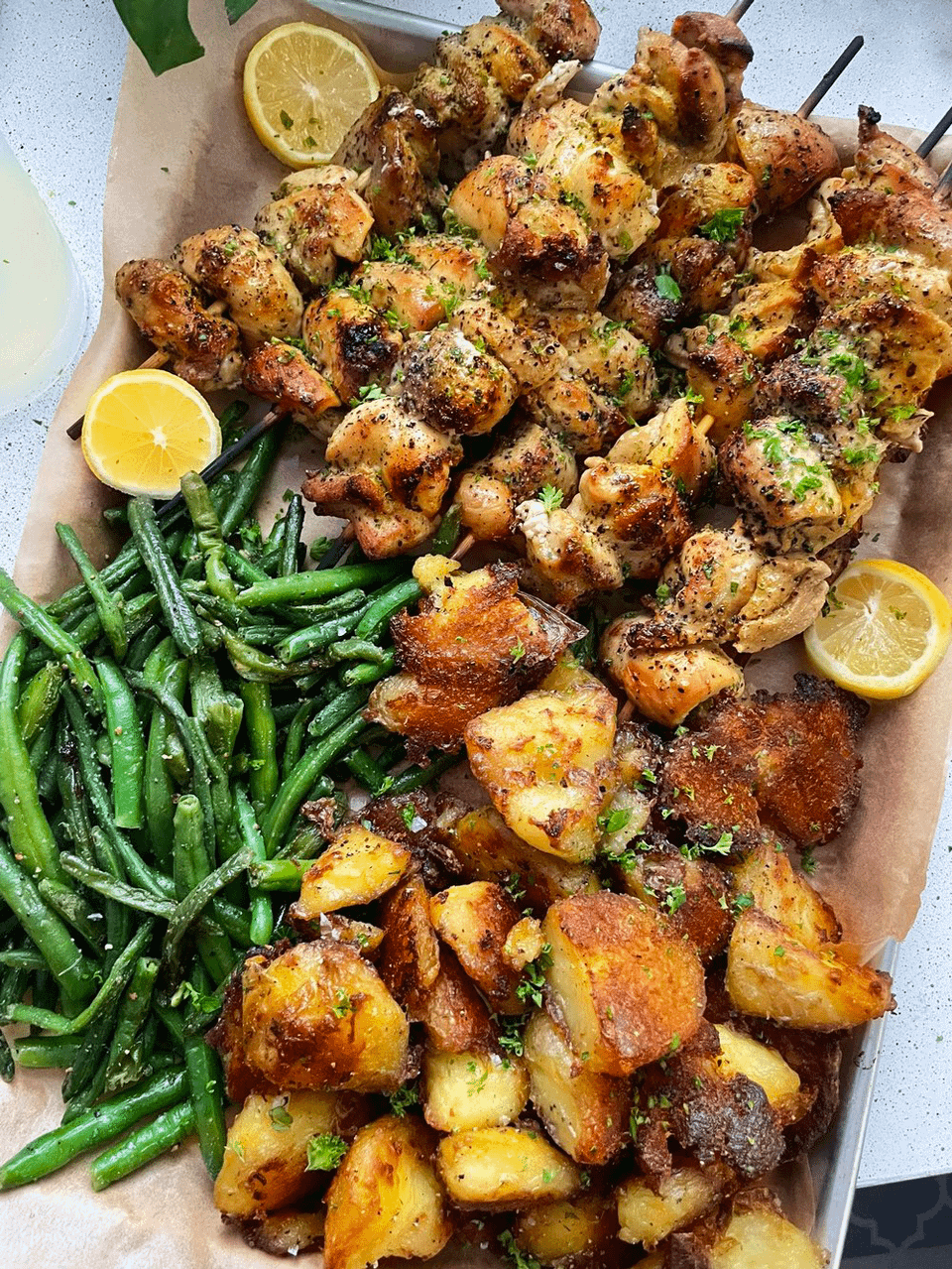 Lemon pepper chicken kabobs, garlicky green beans, and roasted duck fat ...