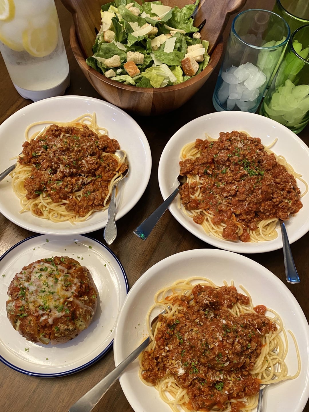 Spaghetti and meatballs with ricotta stuffed garlic bread and Caesar ...