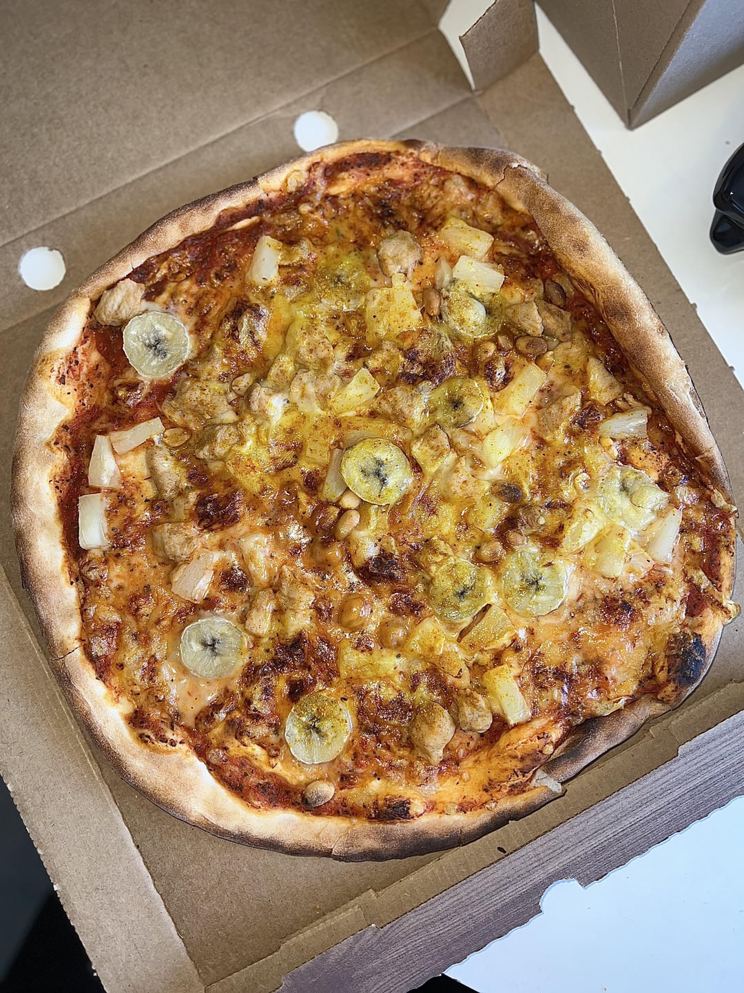 Indiana; pizza with banana, chicken, curry, pineapples and nuts. My ...
