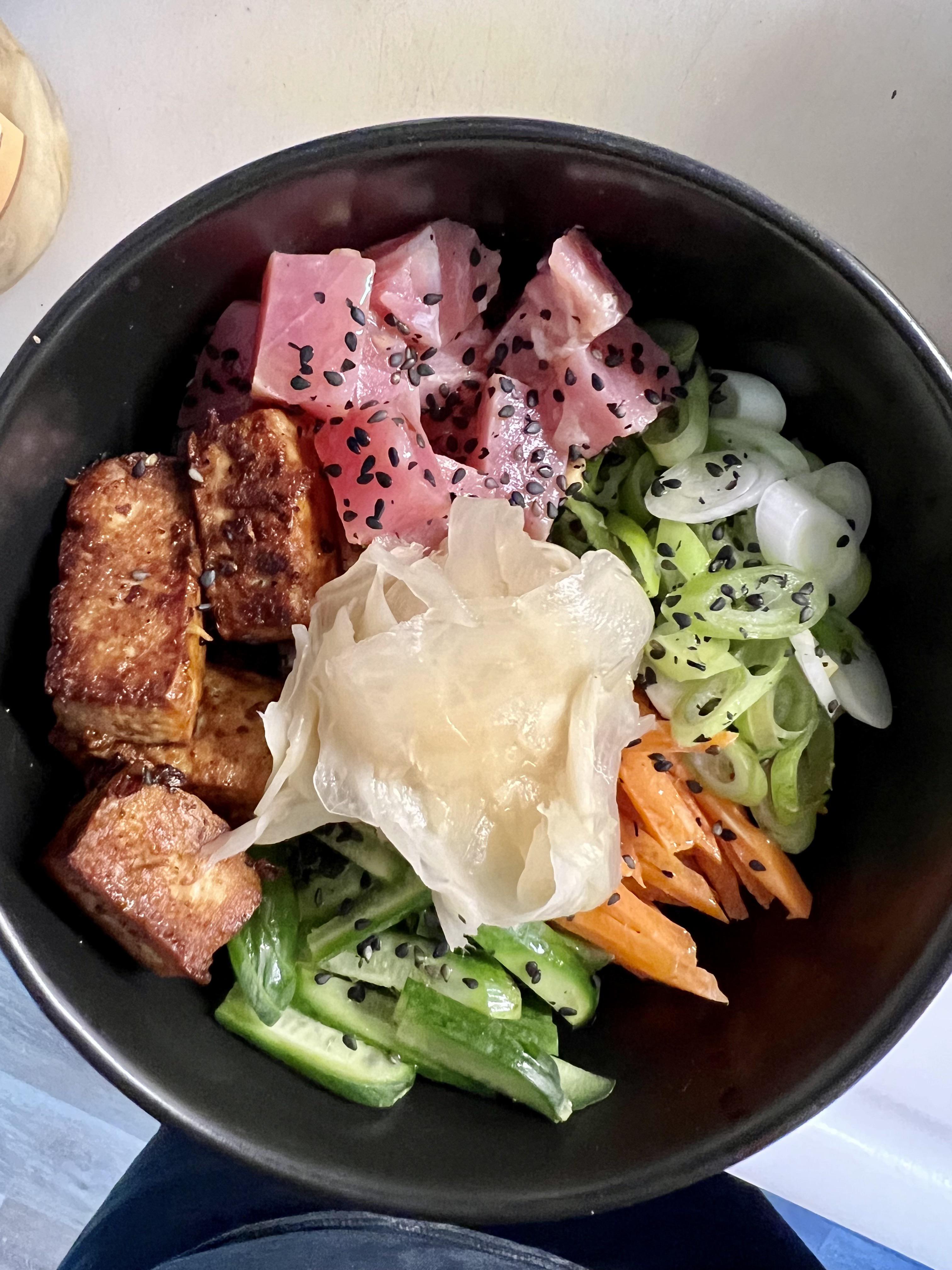 Homemade poké bowls with pan-seared tofu, raw tuna, served over sushi ...