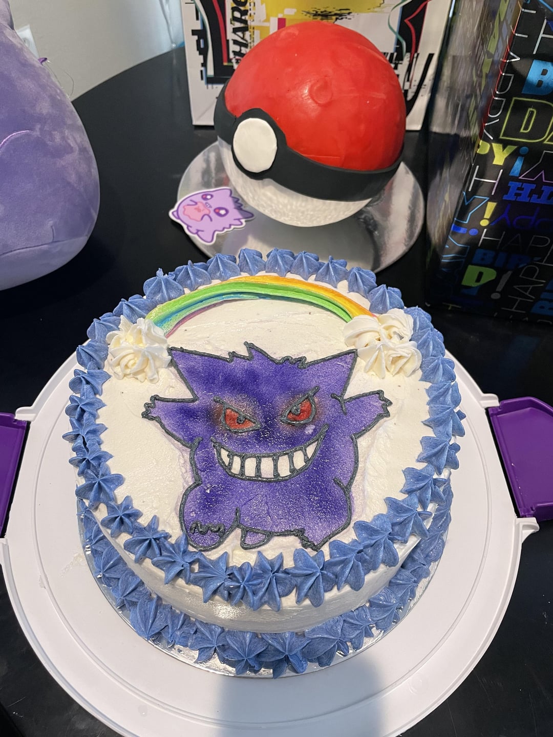 My kid wanted Gengar under a rainbow for his birthday cake. He loves it ...