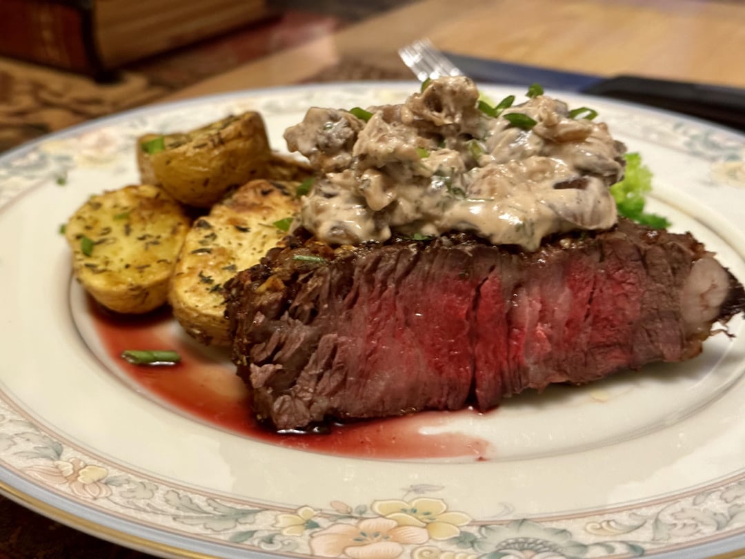 Ribeye, roasted potatoes, mushroom topping and steamed broccoli ...