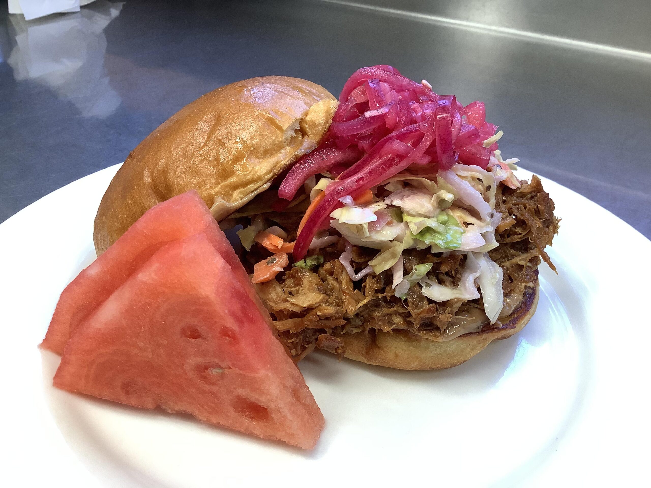 Pulled pork, BBQ mayo, coleslaw and a quick pickle red onion on toasted ...