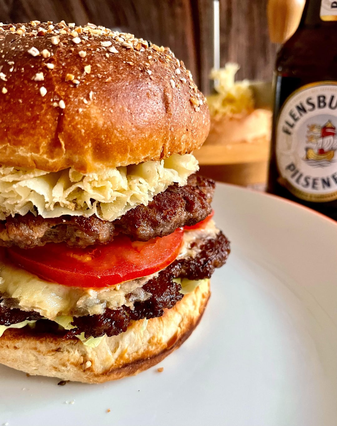 Double smashed cheeseburger with tête de moine, tomato, lettuce and ...