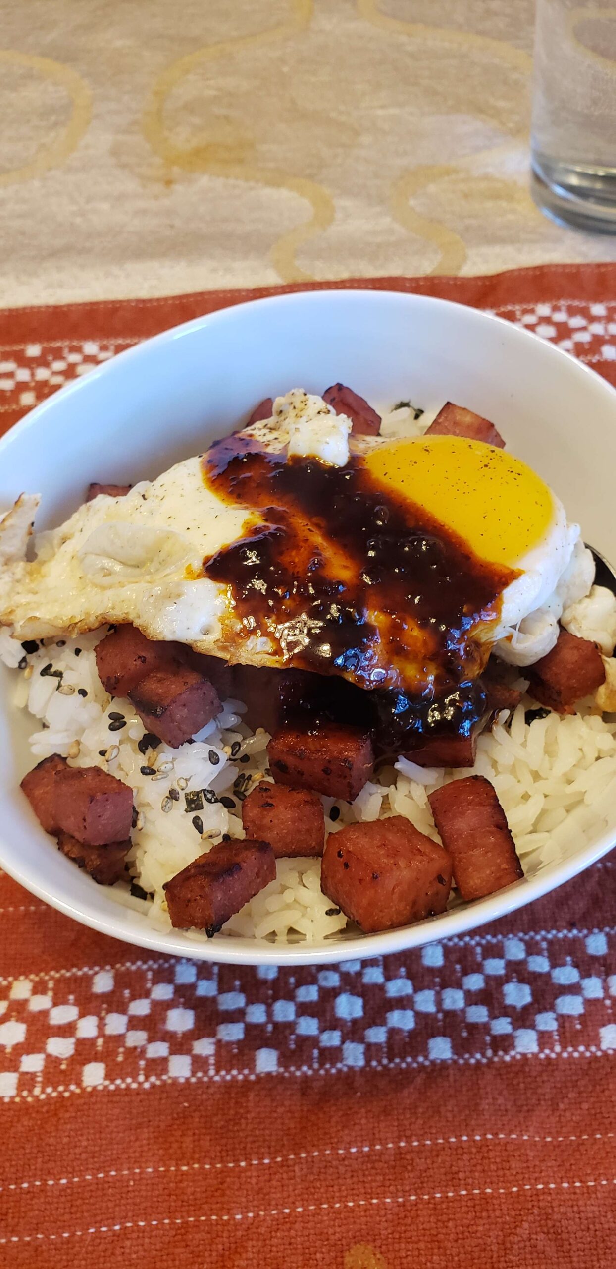 Breakfast. Runny egg, fresh rice, spam, furikake, chili oil, and soy ...