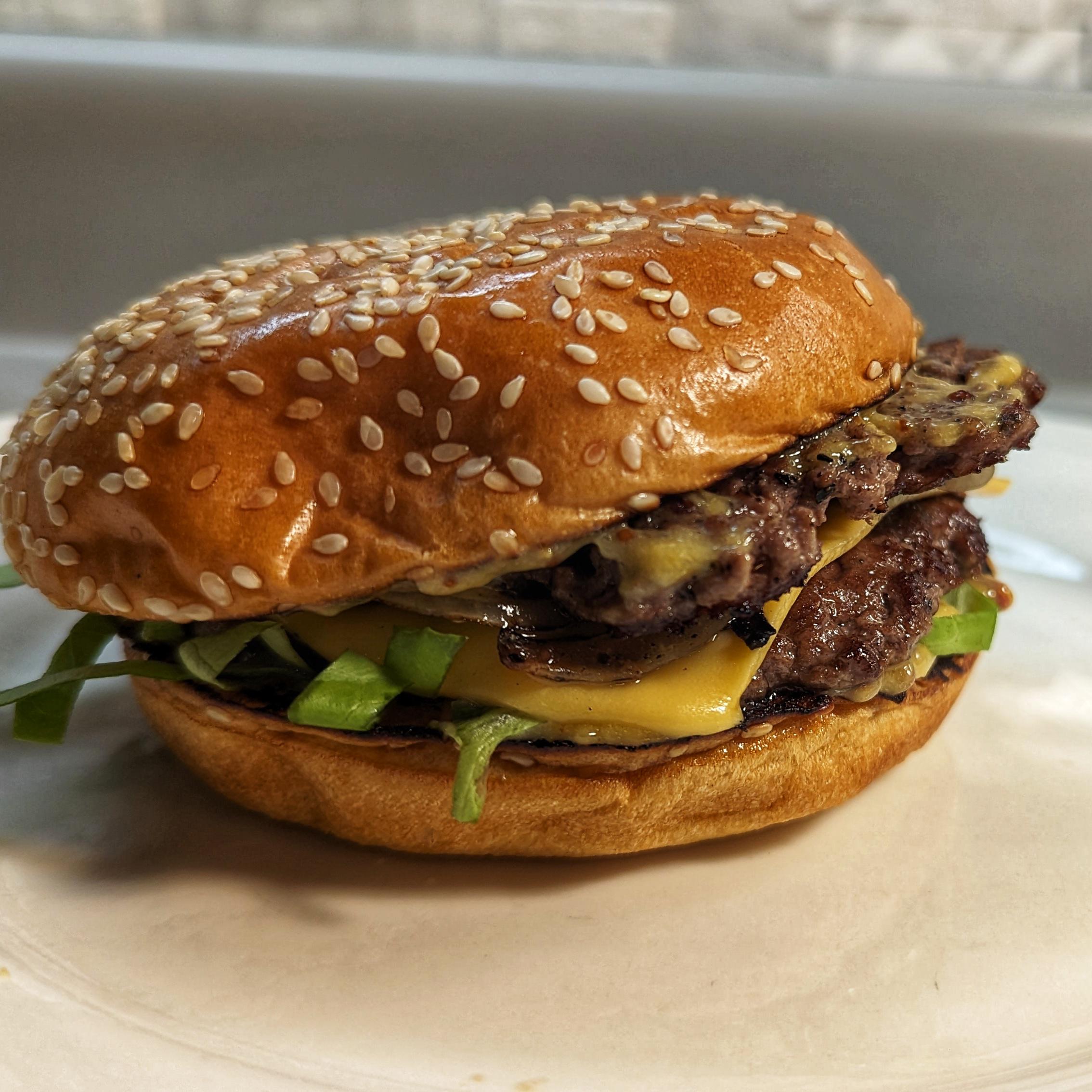 Double smash burger with cheese on brioche - Dining and Cooking