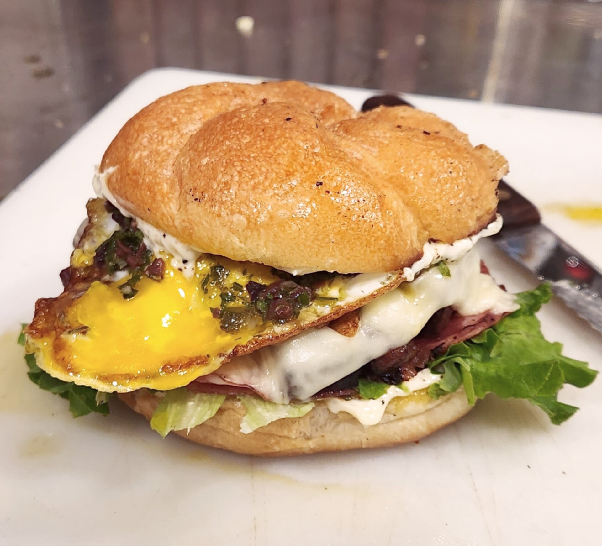 Lomito Completo: chopped 10-hour smoked beef, deli ham, Cooper sharp ...